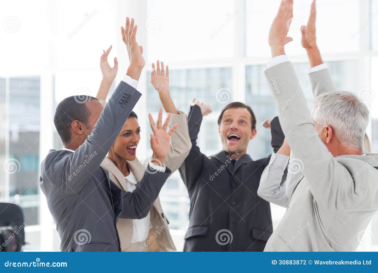 Group of Smiling Business People Raising Their Hands Stock Photo ...