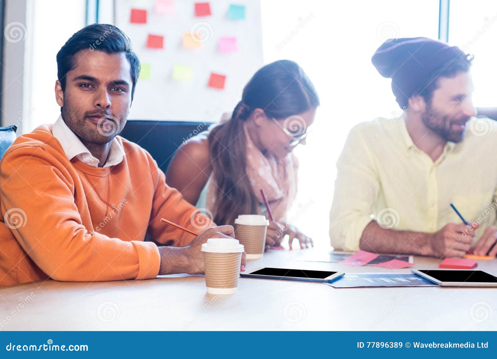 Group of smiling coworkers stock image. Image of meeting - 77896389