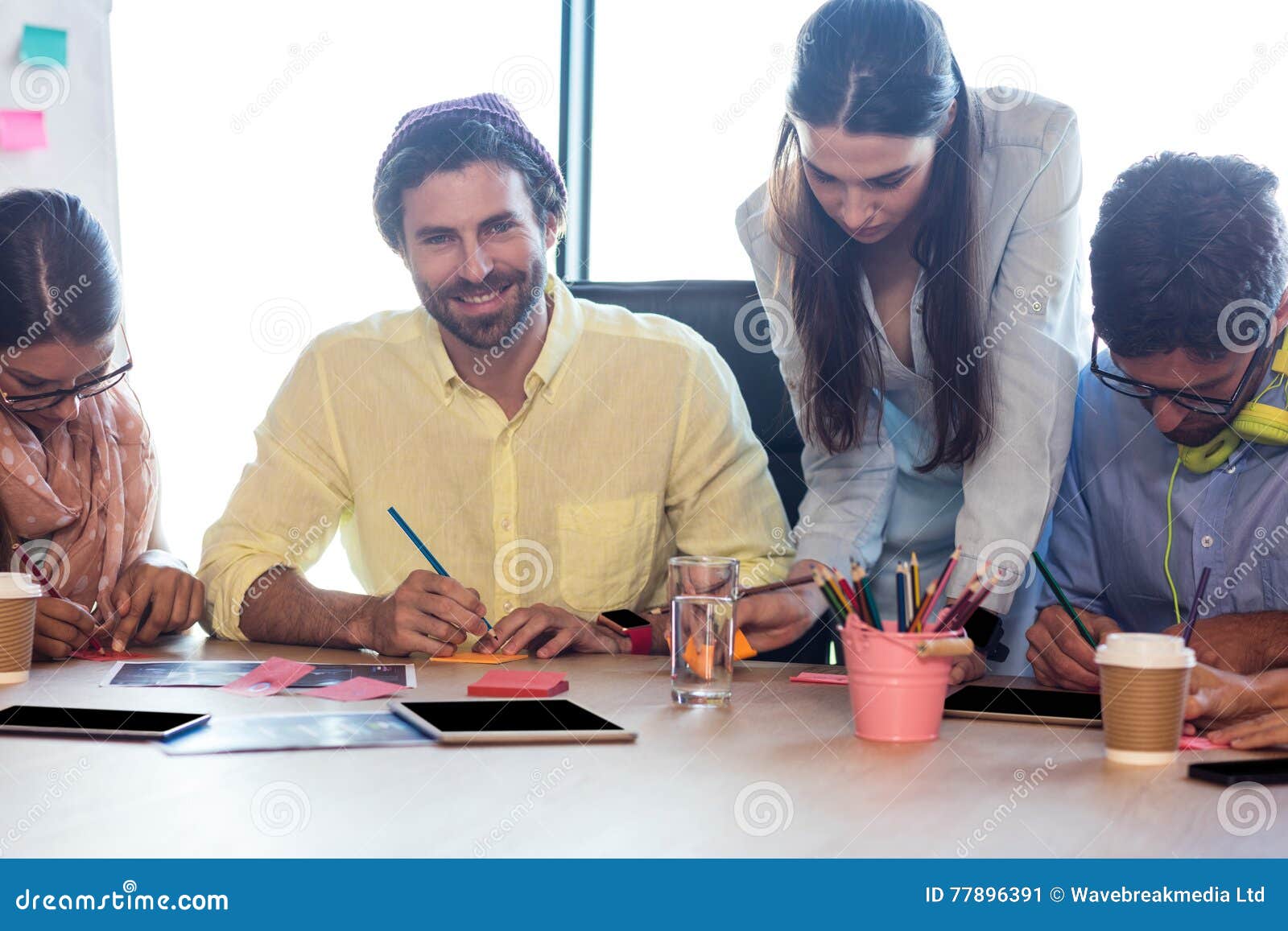 Group of smiling coworkers stock image. Image of meeting - 77896391