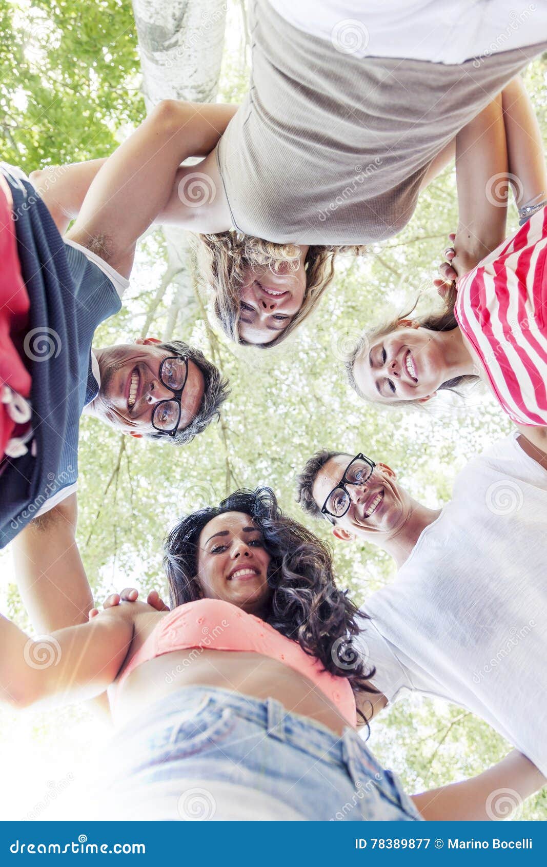 Group of Smiling Friends in Circle - Bottom View Stock Image - Image of ...