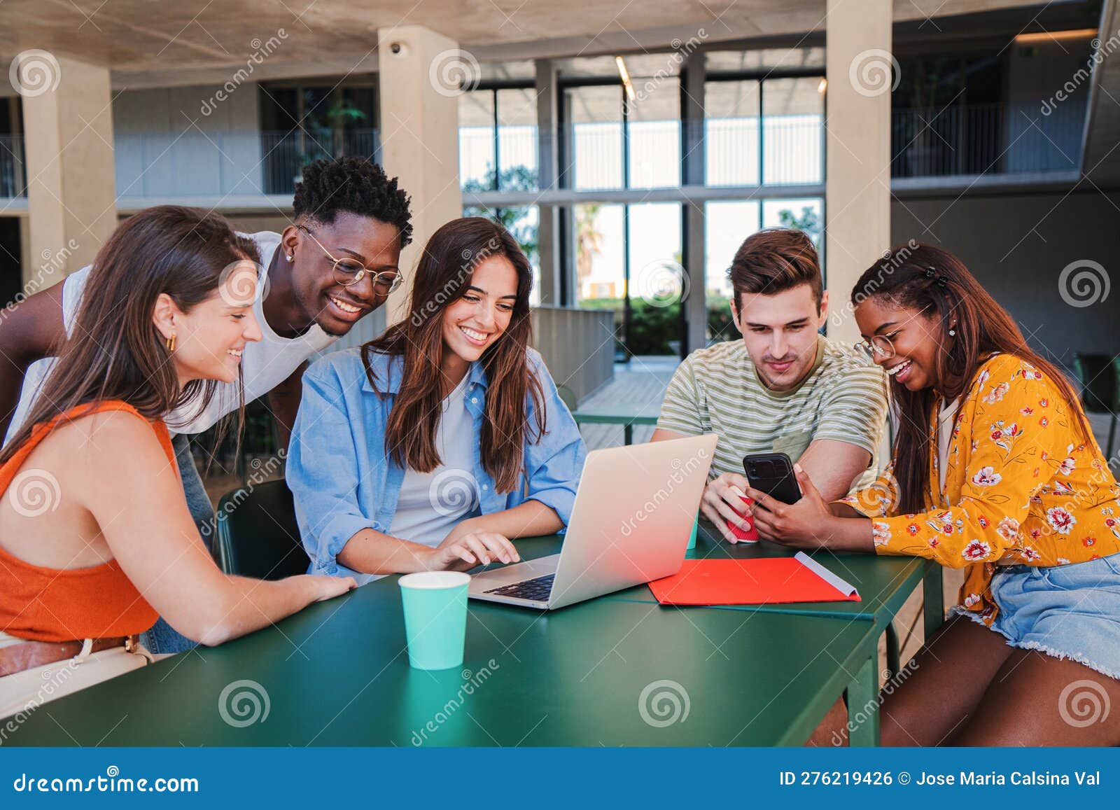 Group of Smiling Multiracial International Students Learning with a ...