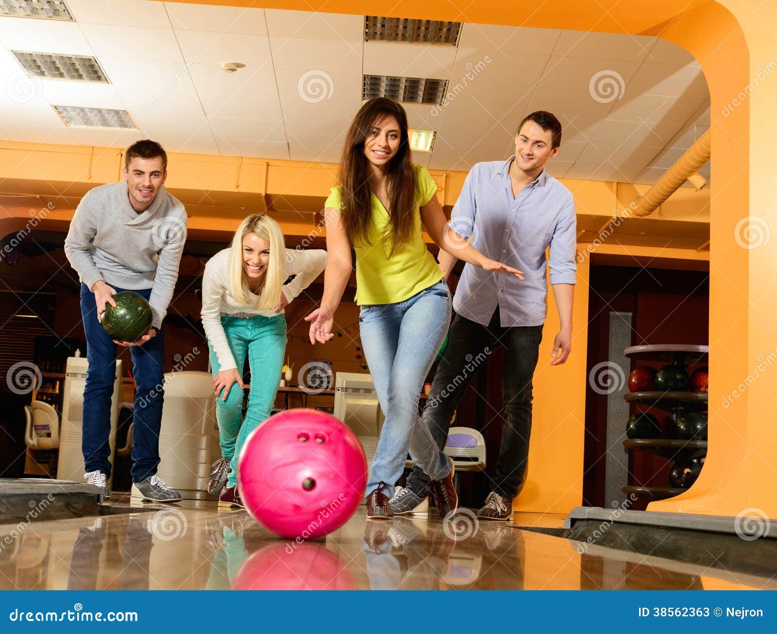 Group of Smiling People Playing Bowling Stock Image - Image of brunette ...