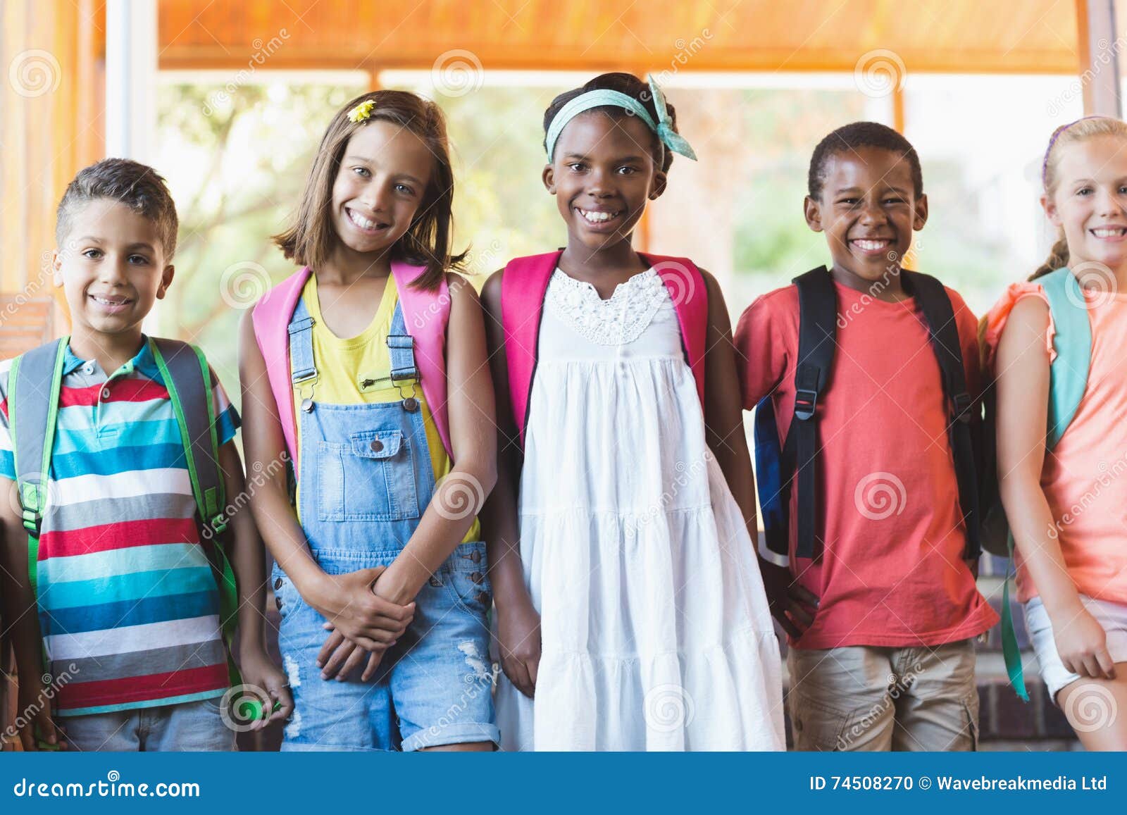 Group of Smiling School Kids Standing in Row Stock Photo - Image of ...