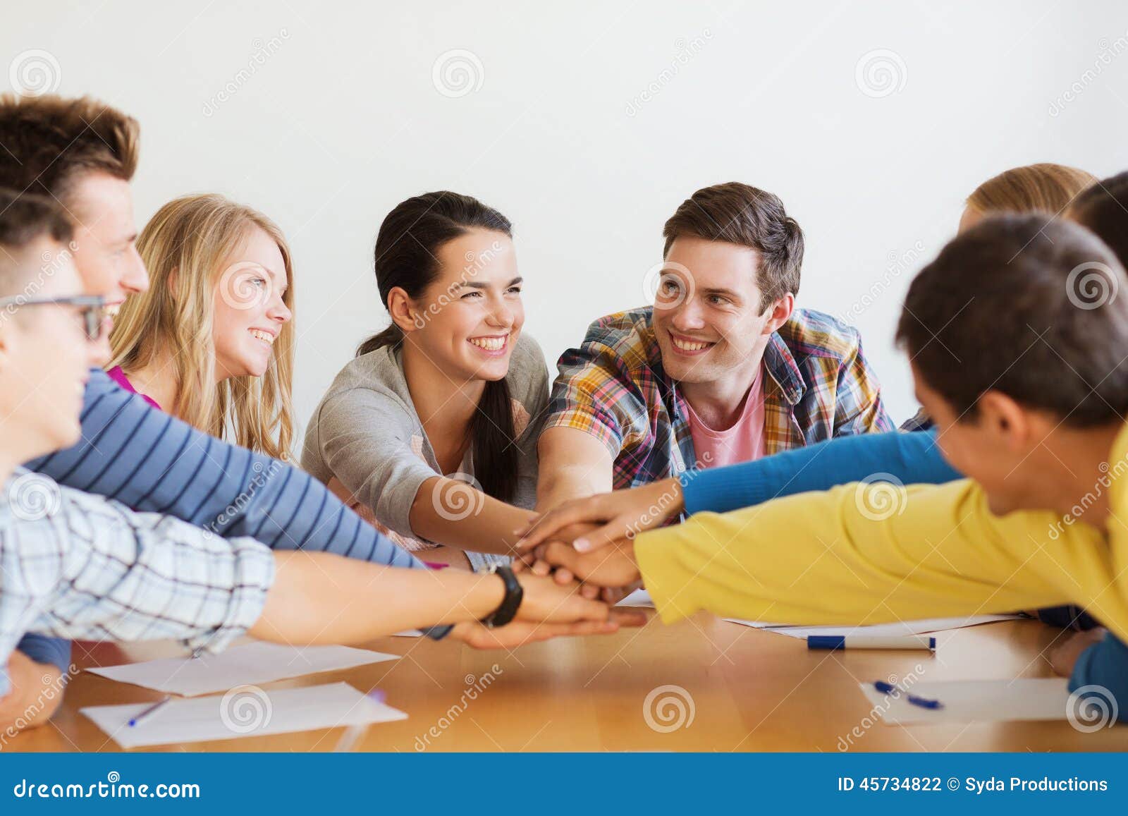 Group of Smiling Students with Hand on Top Stock Photo - Image of ...