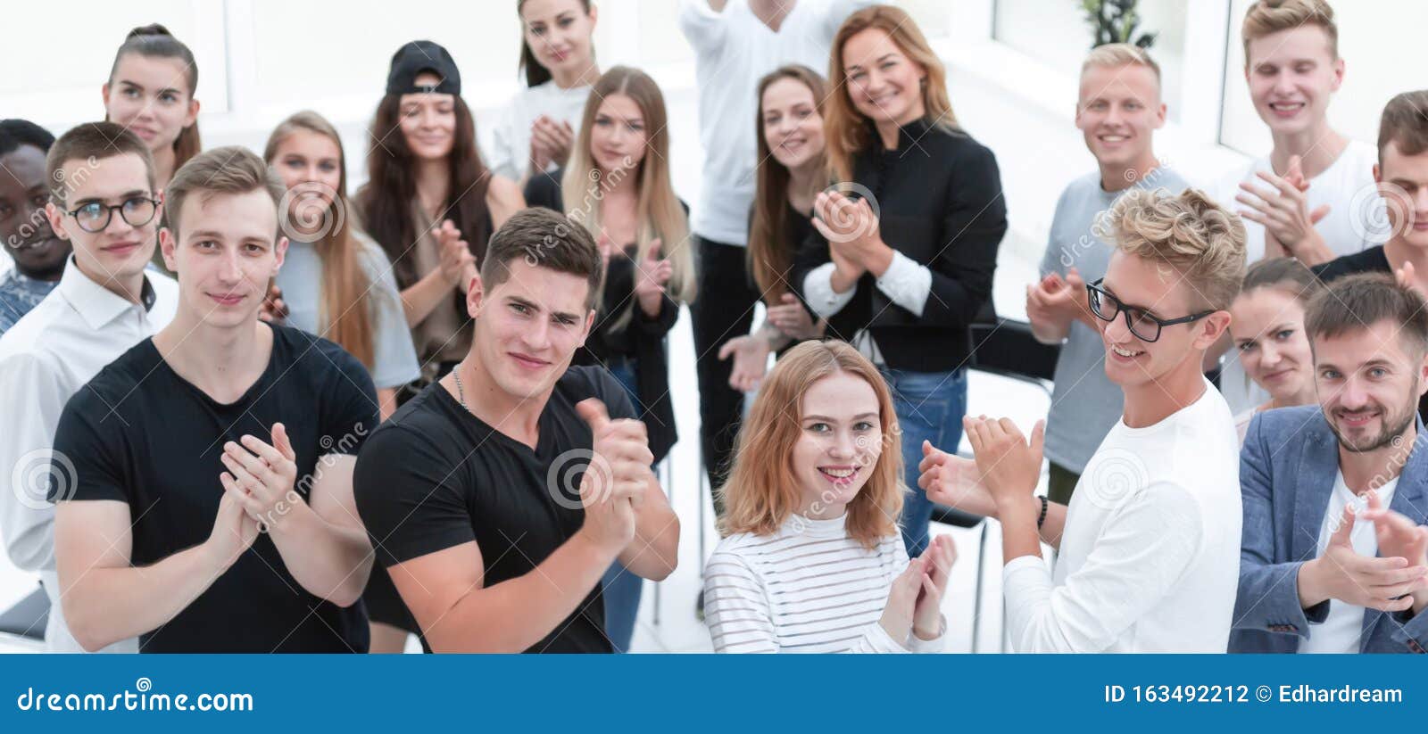 Group of Smiling Young People Applaud Together Stock Photo - Image of ...