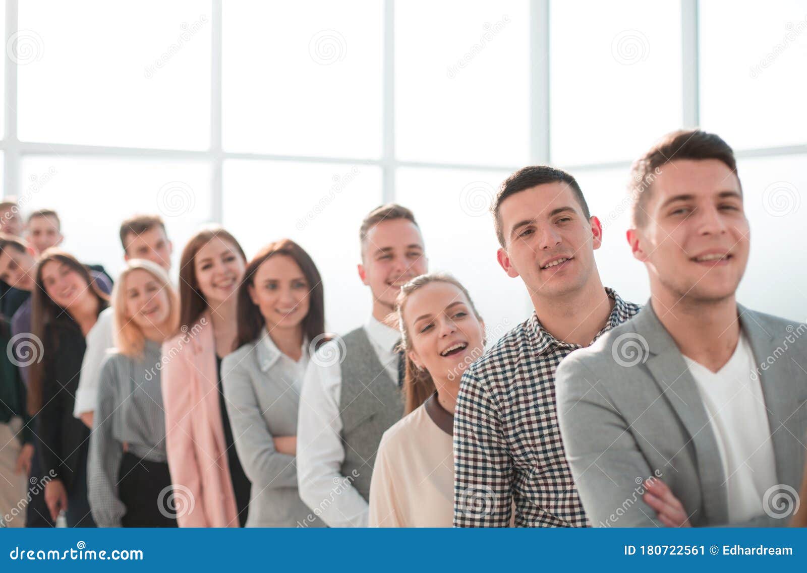 Group of Smiling Young Professionals Standing in a Row. Stock Image ...