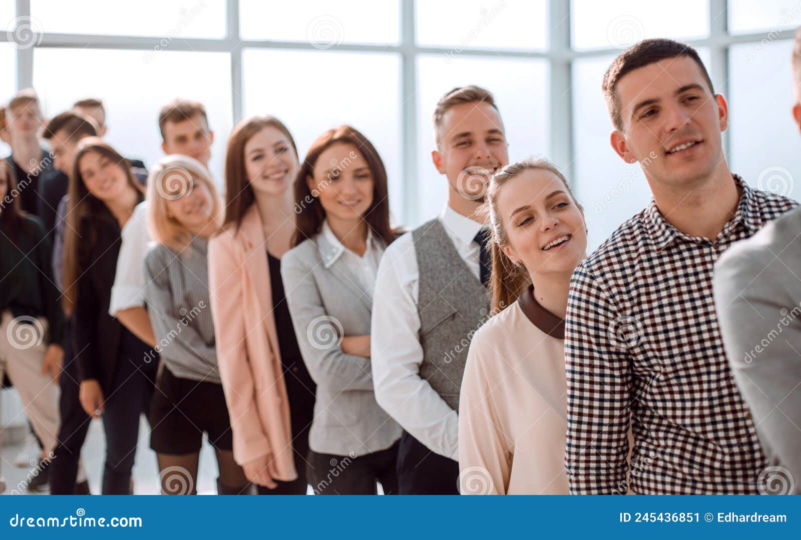 Group of Smiling Young Professionals Standing in a Row. Stock Image ...
