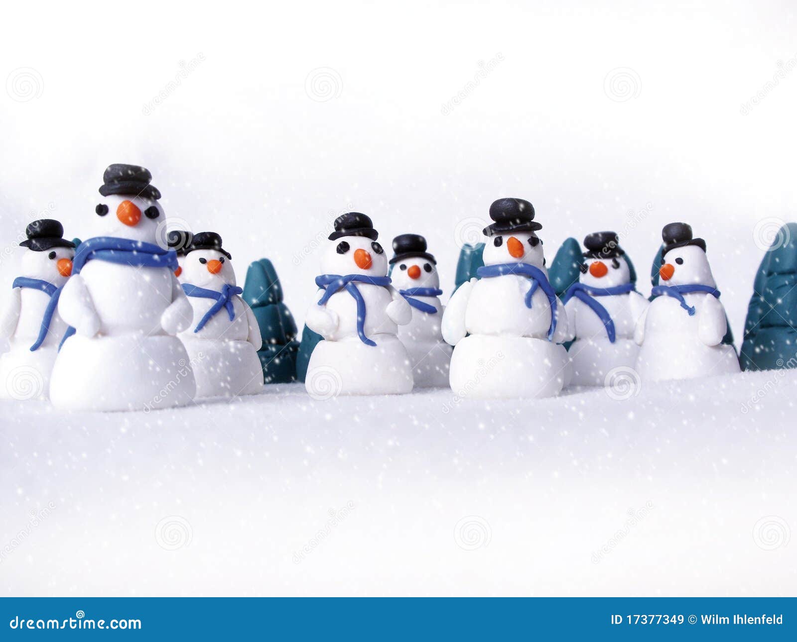 A Group Of Snowmen In The Snow Stock Image - Image: 17377349