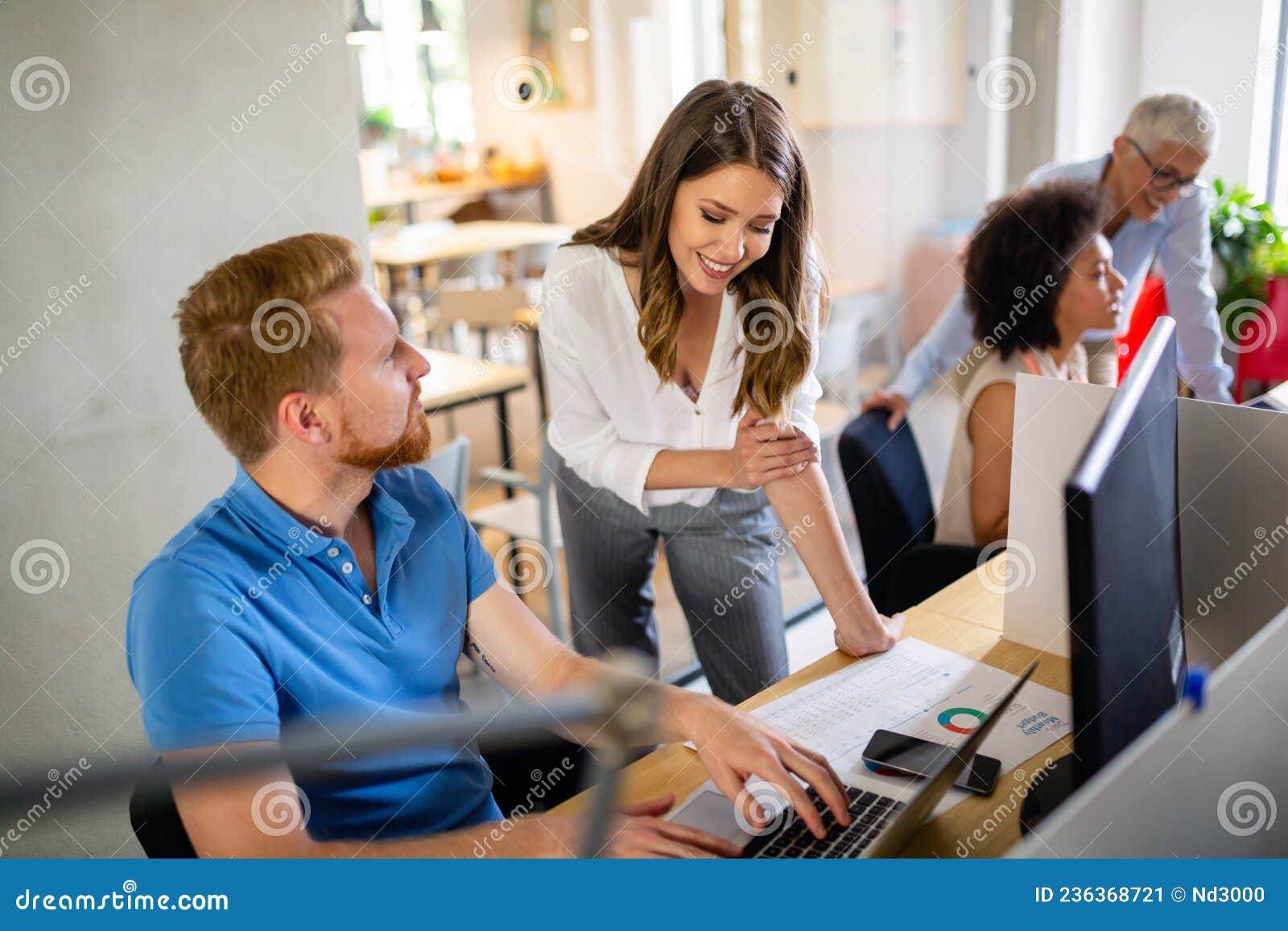 Group of Software Engineers Working Developing Applications Together in ...