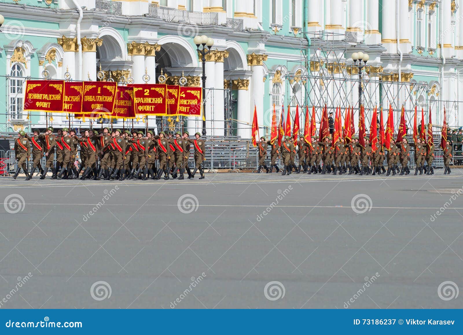 Group Of Soldiers-reenactors Ride Horses, Two Men Carry Flags ... Group Of Soldiers-reenactors Ride Horses, Two Men Carry Flags ...