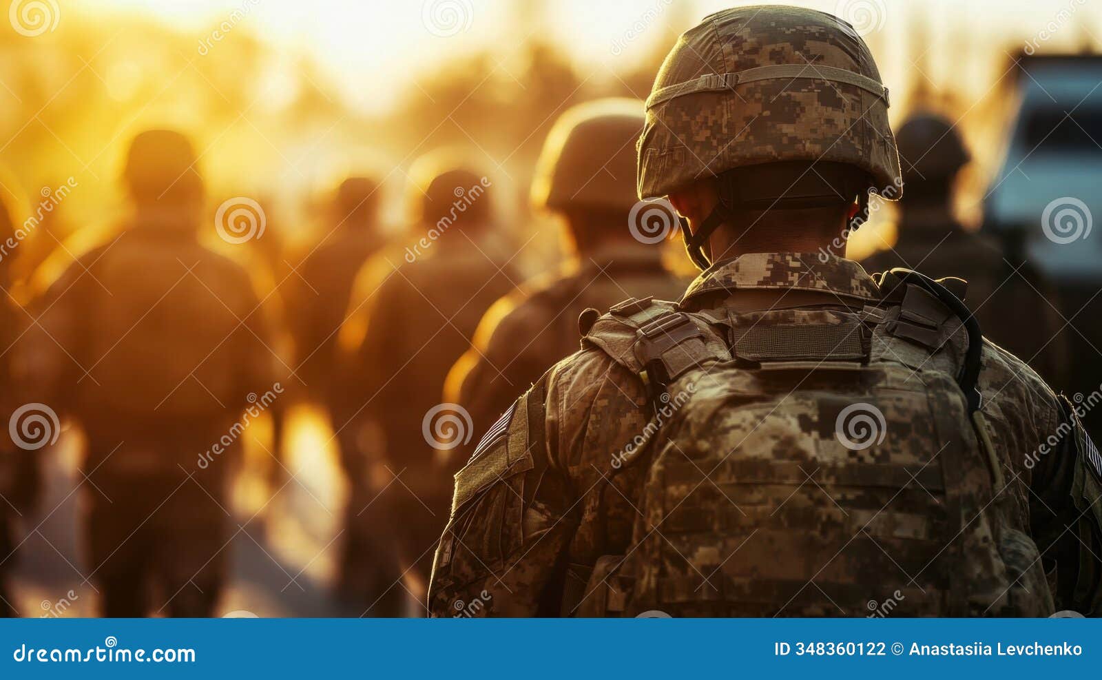 A Group of Soldiers in Camouflage Uniforms Marching Under the Warm Glow ...