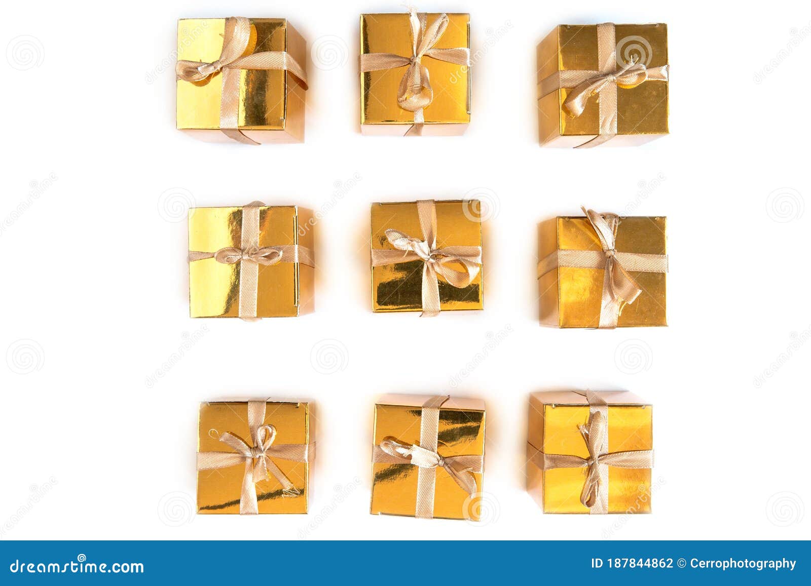 Group of Sparkling Gold Present or Gift Boxes in a Row with Bow ...