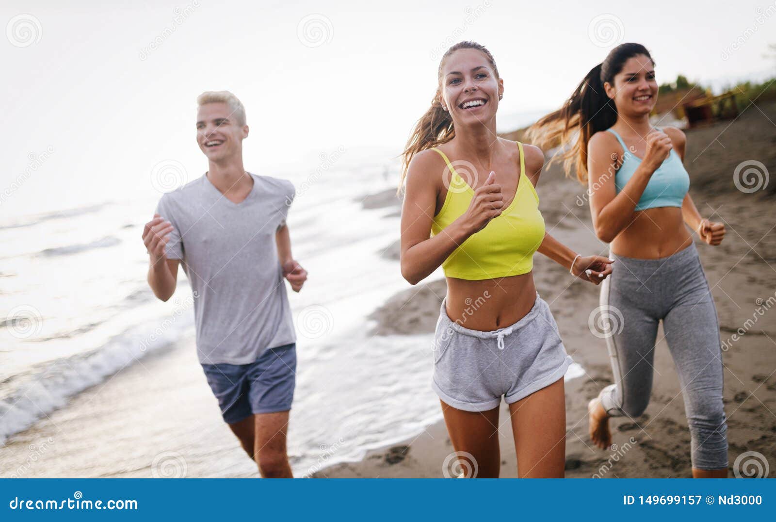 Group of Sport People Running on the Beach Stock Image - Image of ...