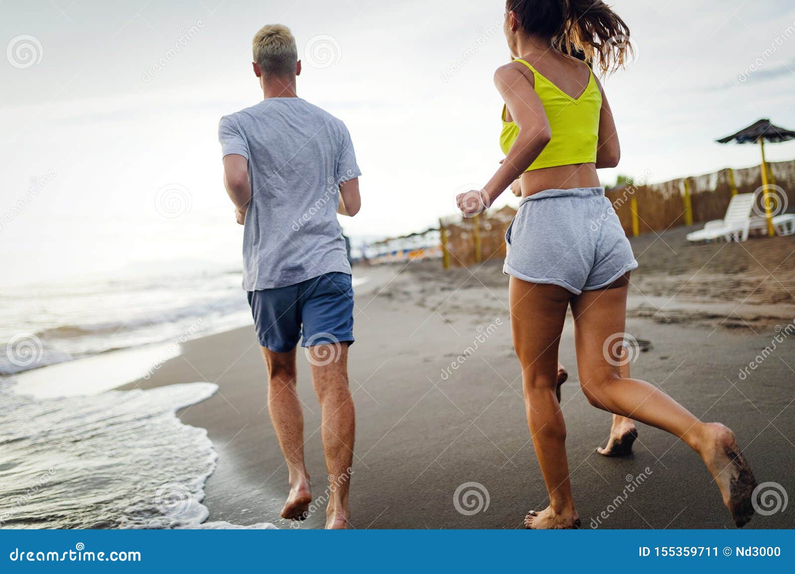 Group of Sport People Running on the Beach Stock Image - Image of ...