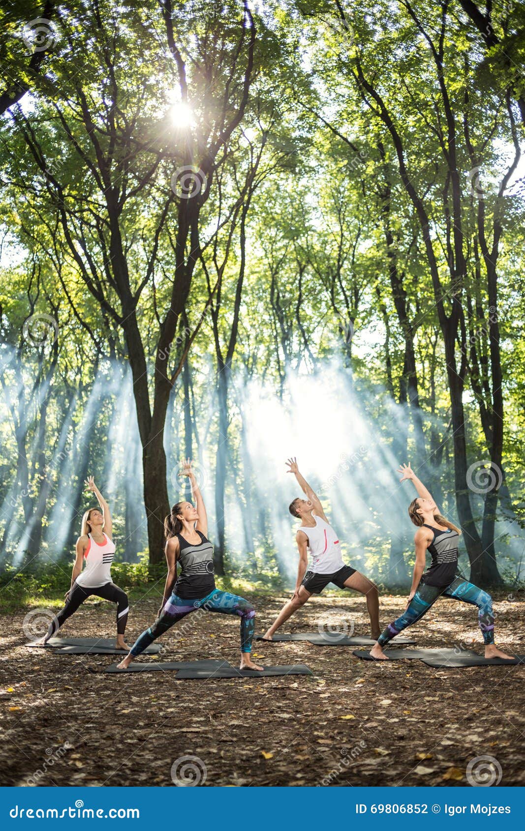 Group of Sporty Persons Doing Exercises in Nature Stock Photo - Image ...