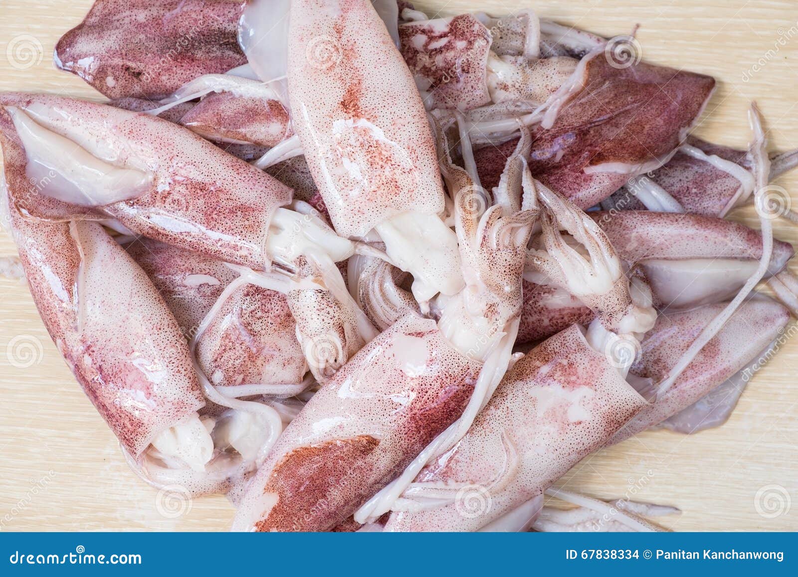 Group of Squid on Wooden Table Stock Photo - Image of cook, kitchen ...