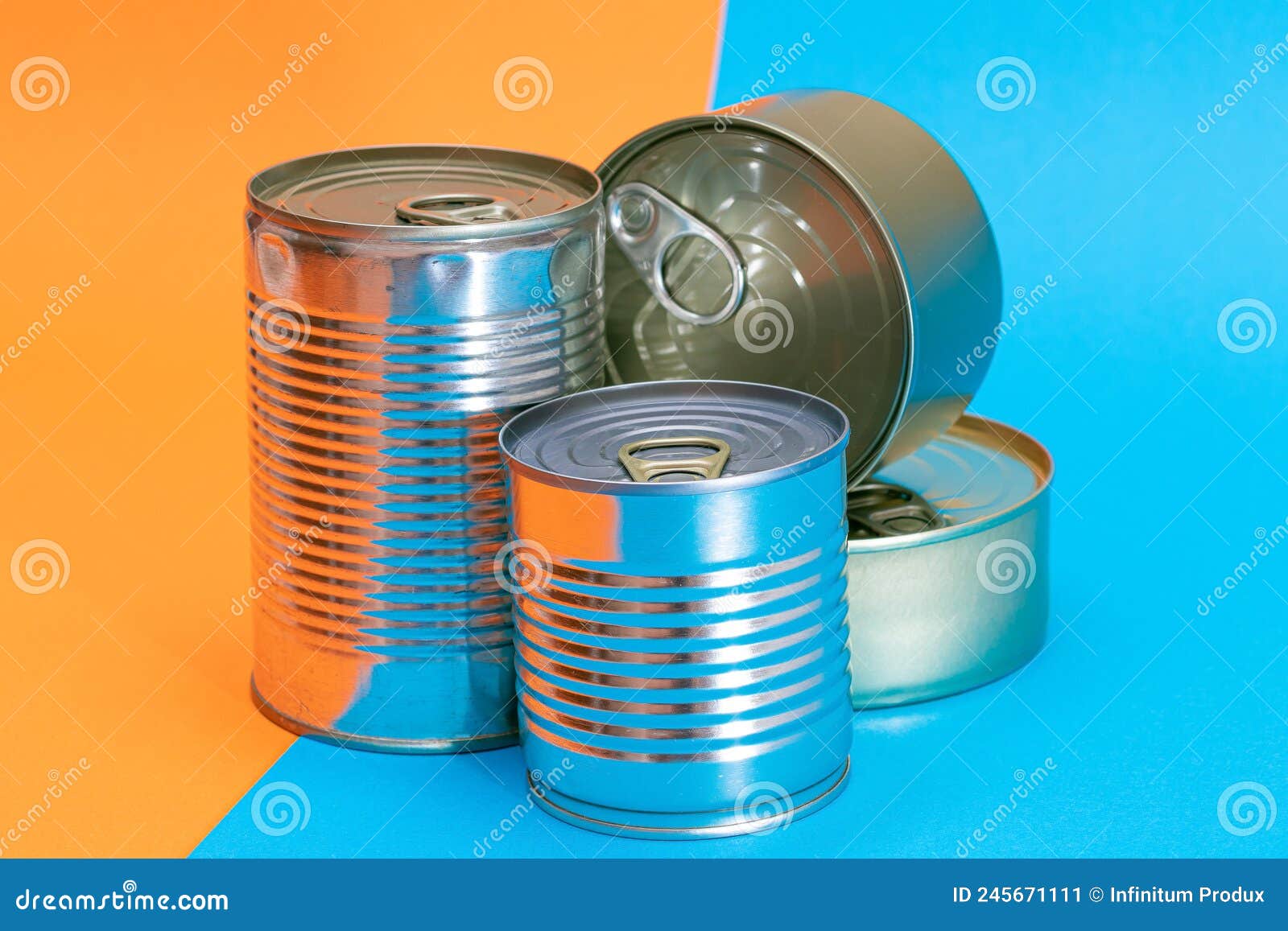 A Group of Stacked Tin Cans with Blank Edges on Split Blue and Orange ...