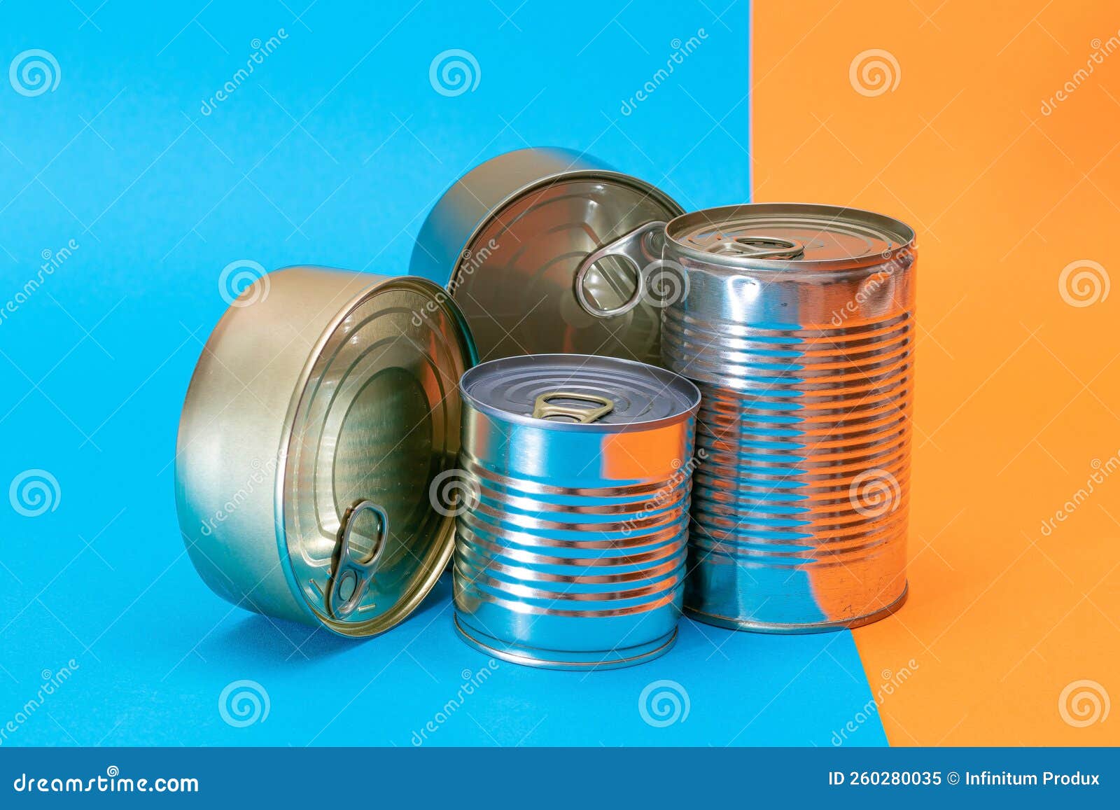 A Group of Stacked Tin Cans with Blank Edges on Split Blue and Orange ...