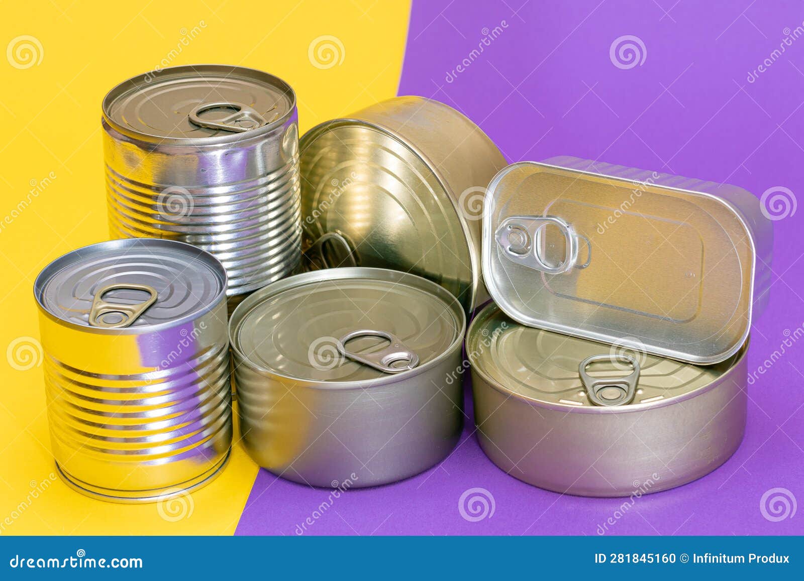 A Group of Stacked Tin Cans with Blank Edges on Split Yellow and Violet ...
