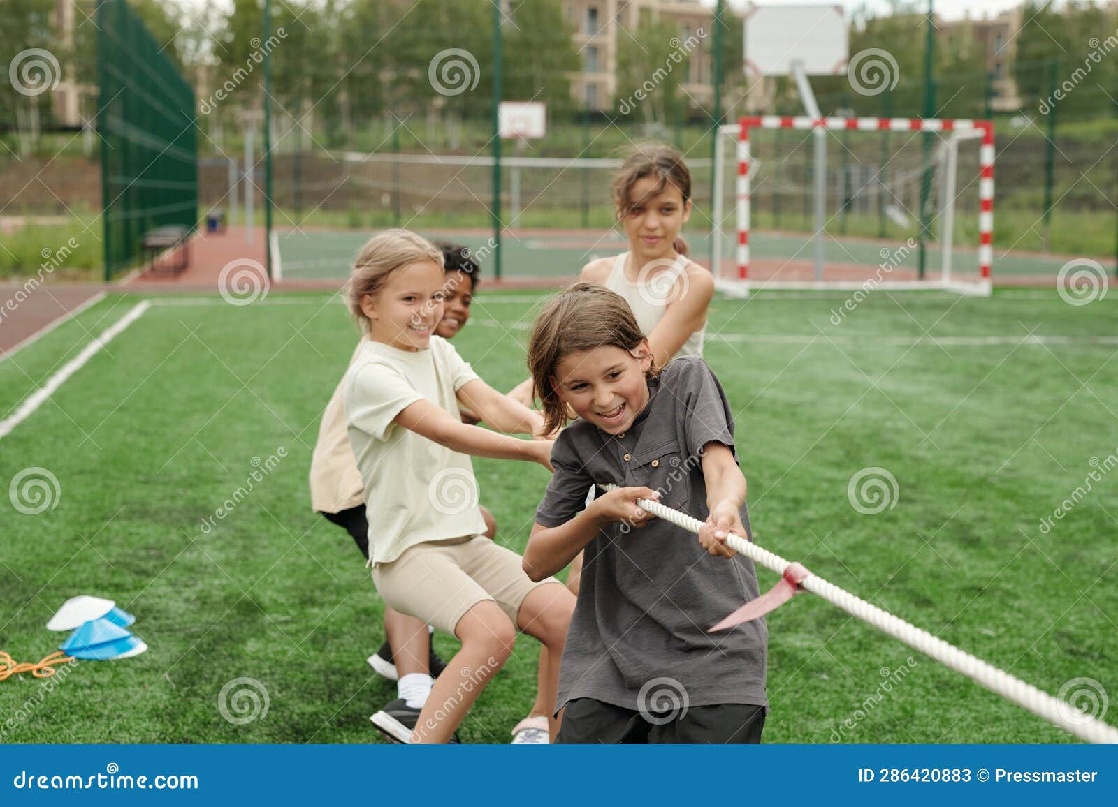 Group of Strong and Active Schoolchildren Making Effort while Pulling ...