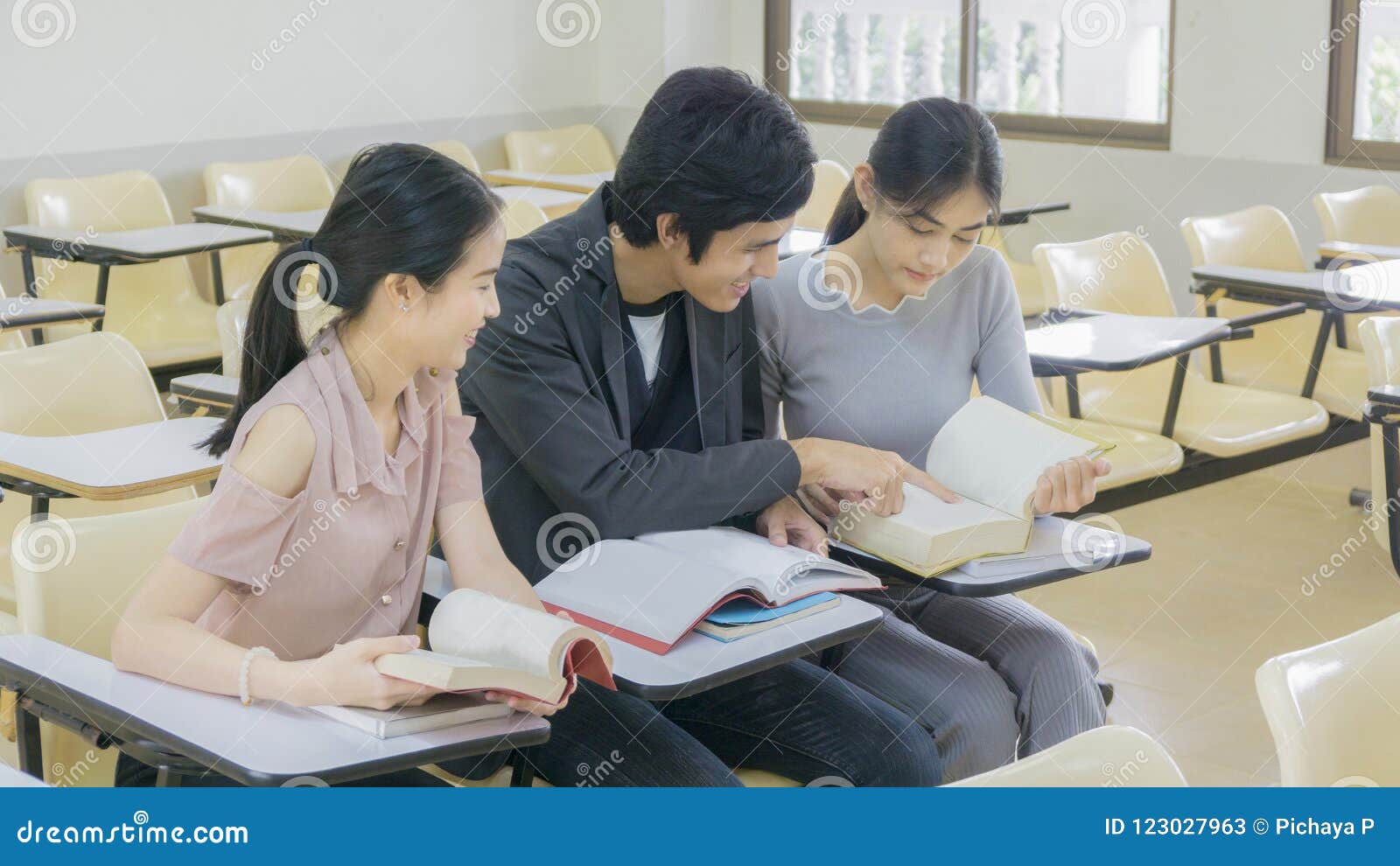 Group Student Read Book and Sit in Classroom Stock Image - Image of ...