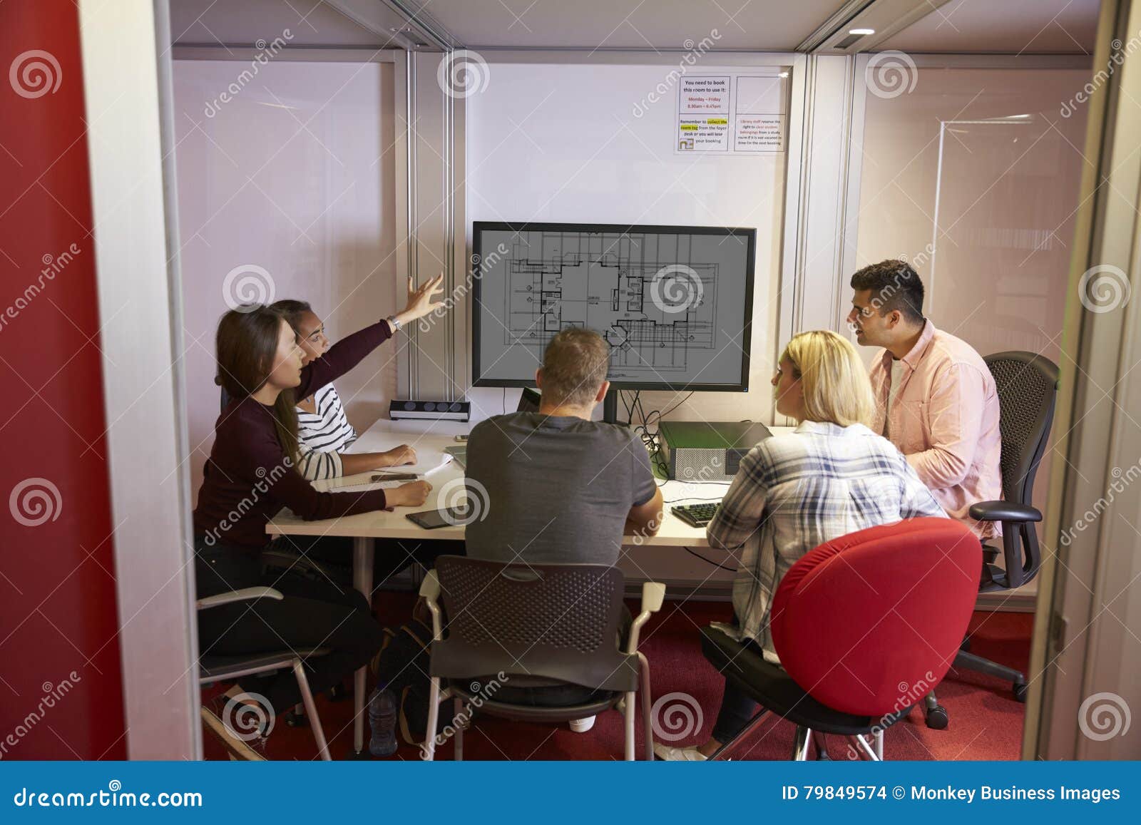 Group of Students Around Screen Collaborating on Project Stock Photo ...