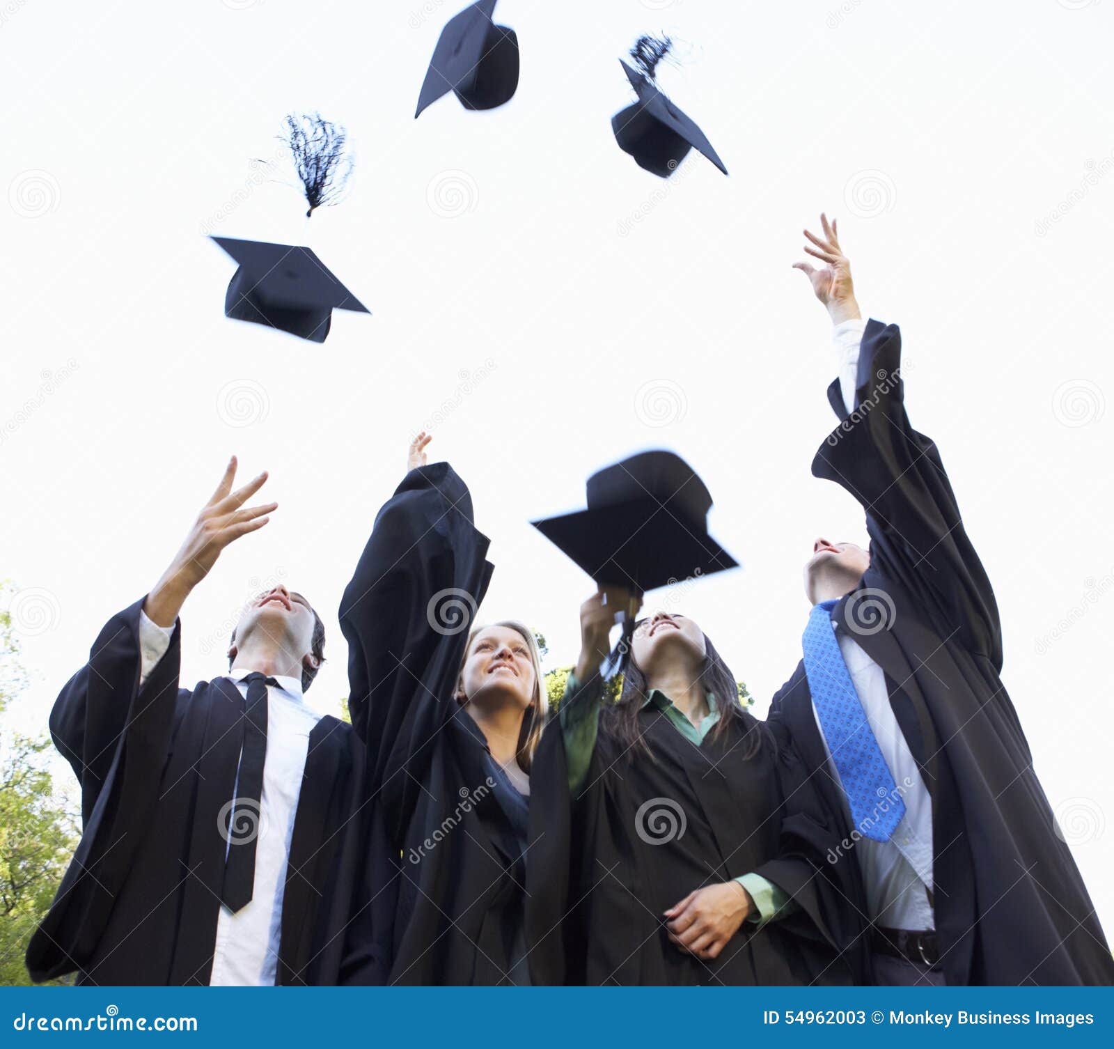 Group of Students Attending Graduation Ceremony Throwing Mortar Boards ...