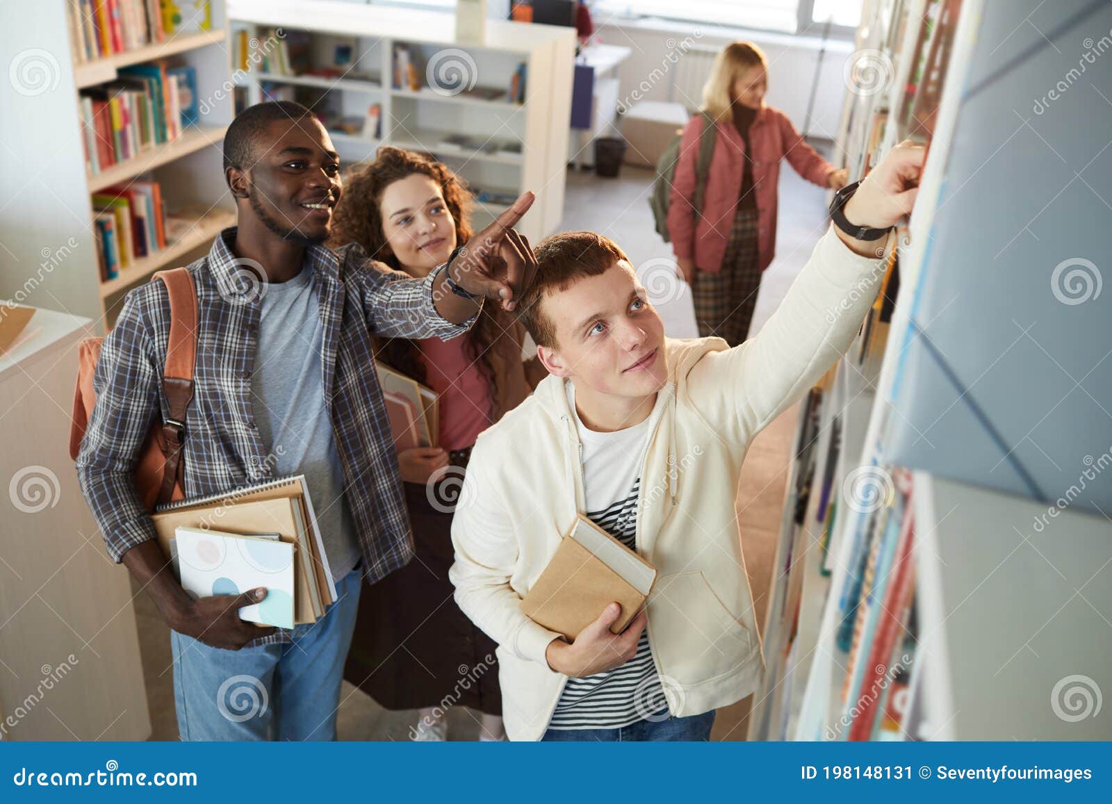 Group of Students Choosing Books in Library Stock Image - Image of ...