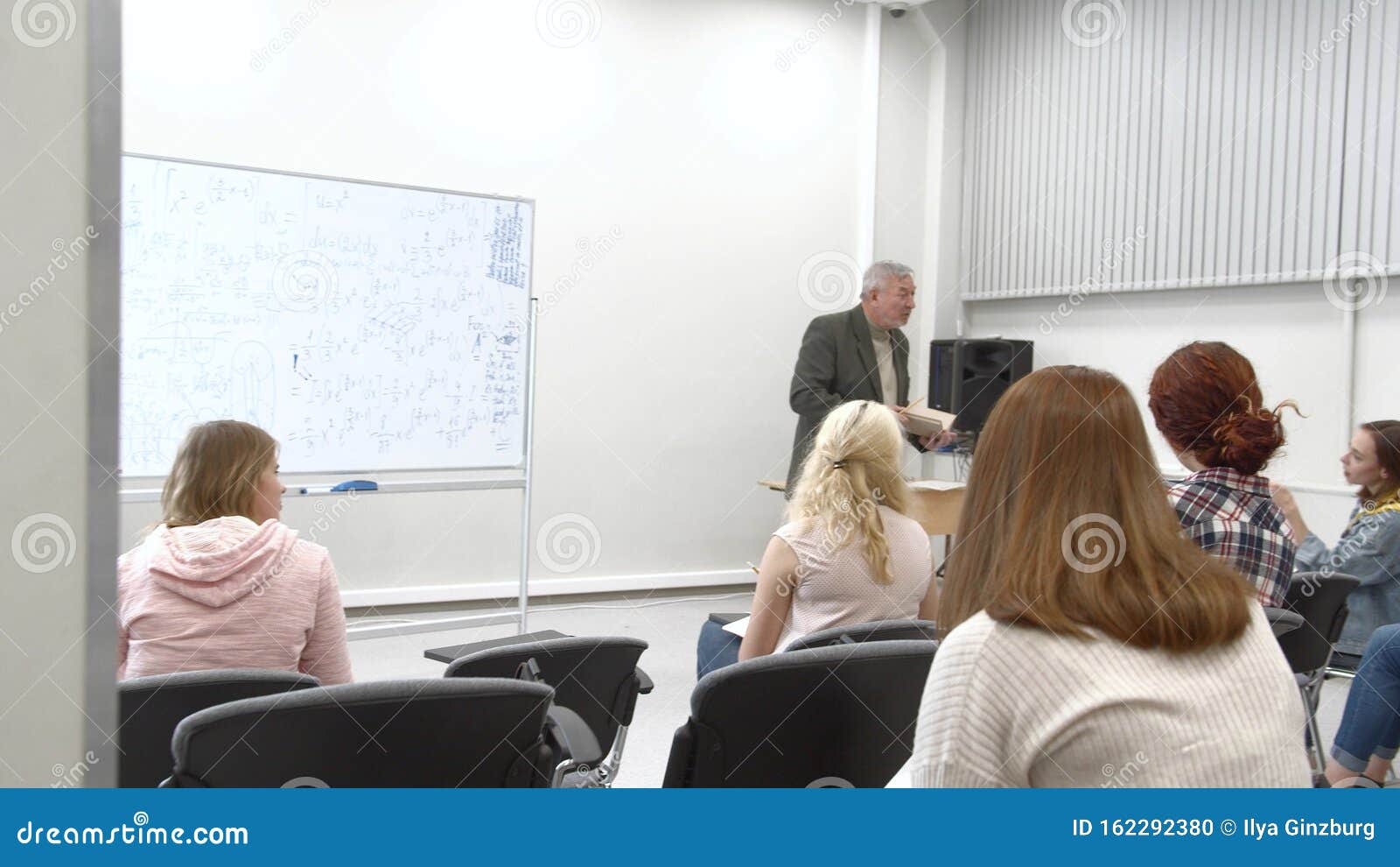 Professor Teach a Class with Group of Students in University. Stock ...