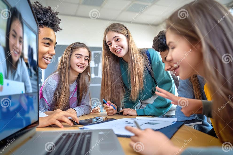 Group of Students Collaborating in Classroom for School Project and ...