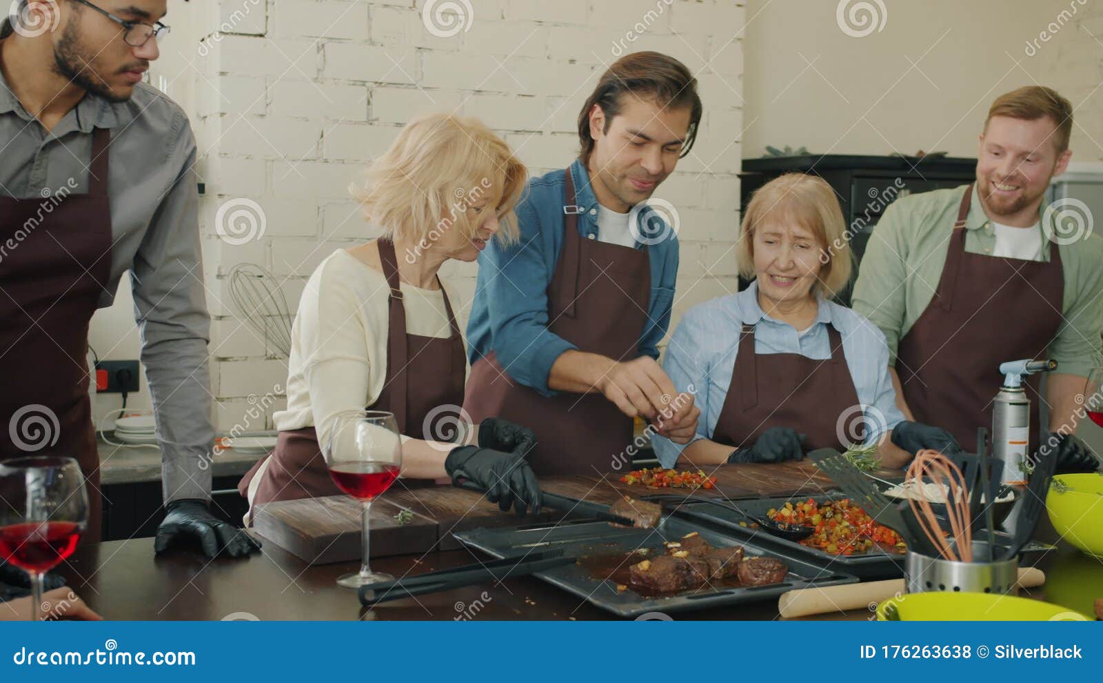 Group of Students of Culinary School Cooking Meal Together Enjoying ...