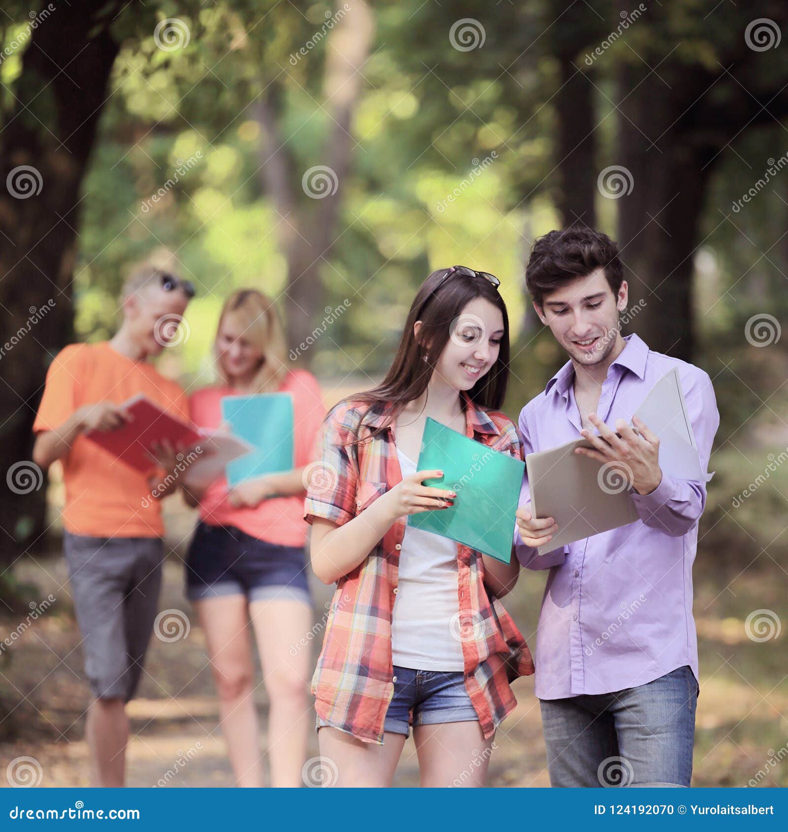 Group of Students Discussing Exam Questions Standing in the Park Stock ...