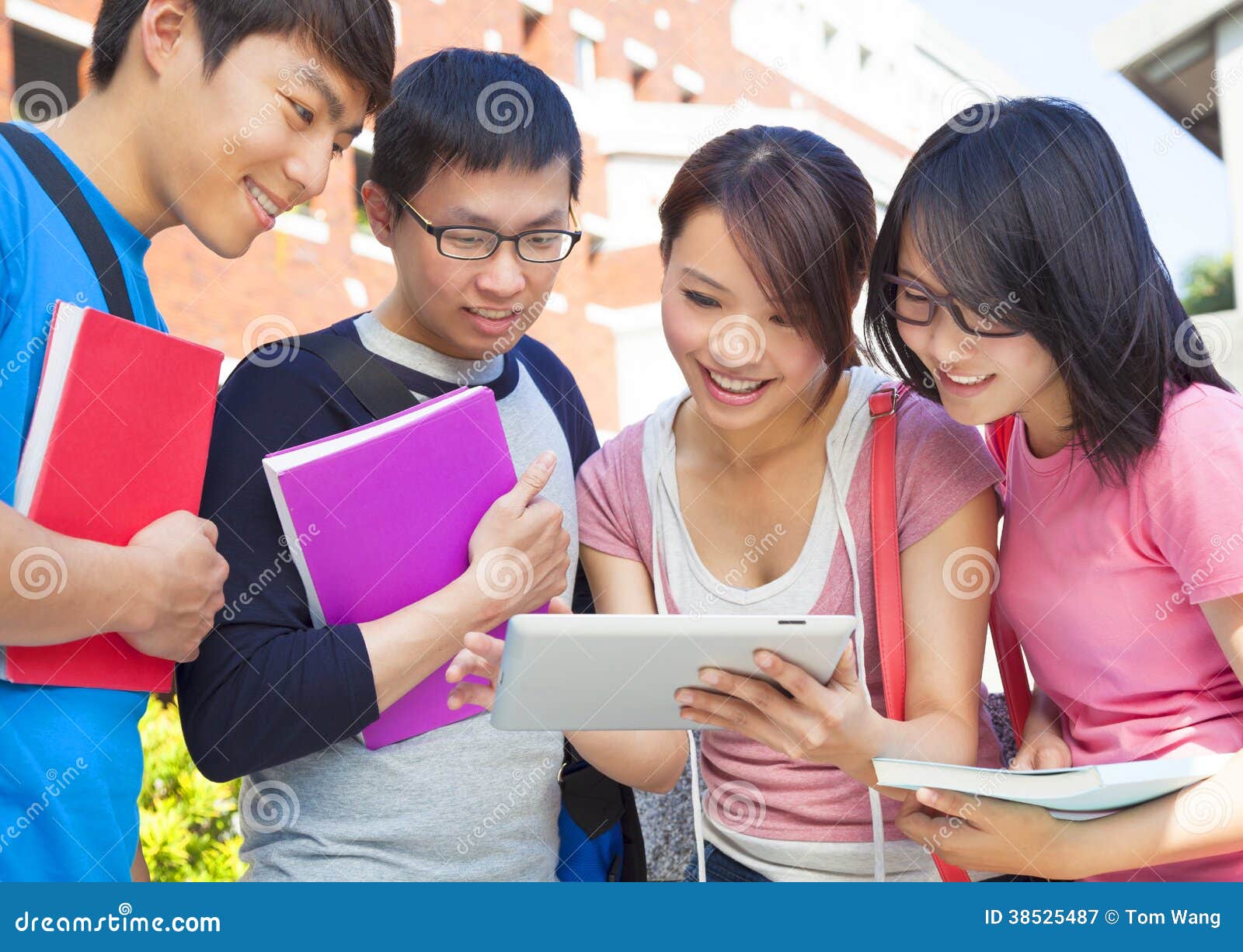Group of Students Discussing Homework by Using Tablet Stock Image ...