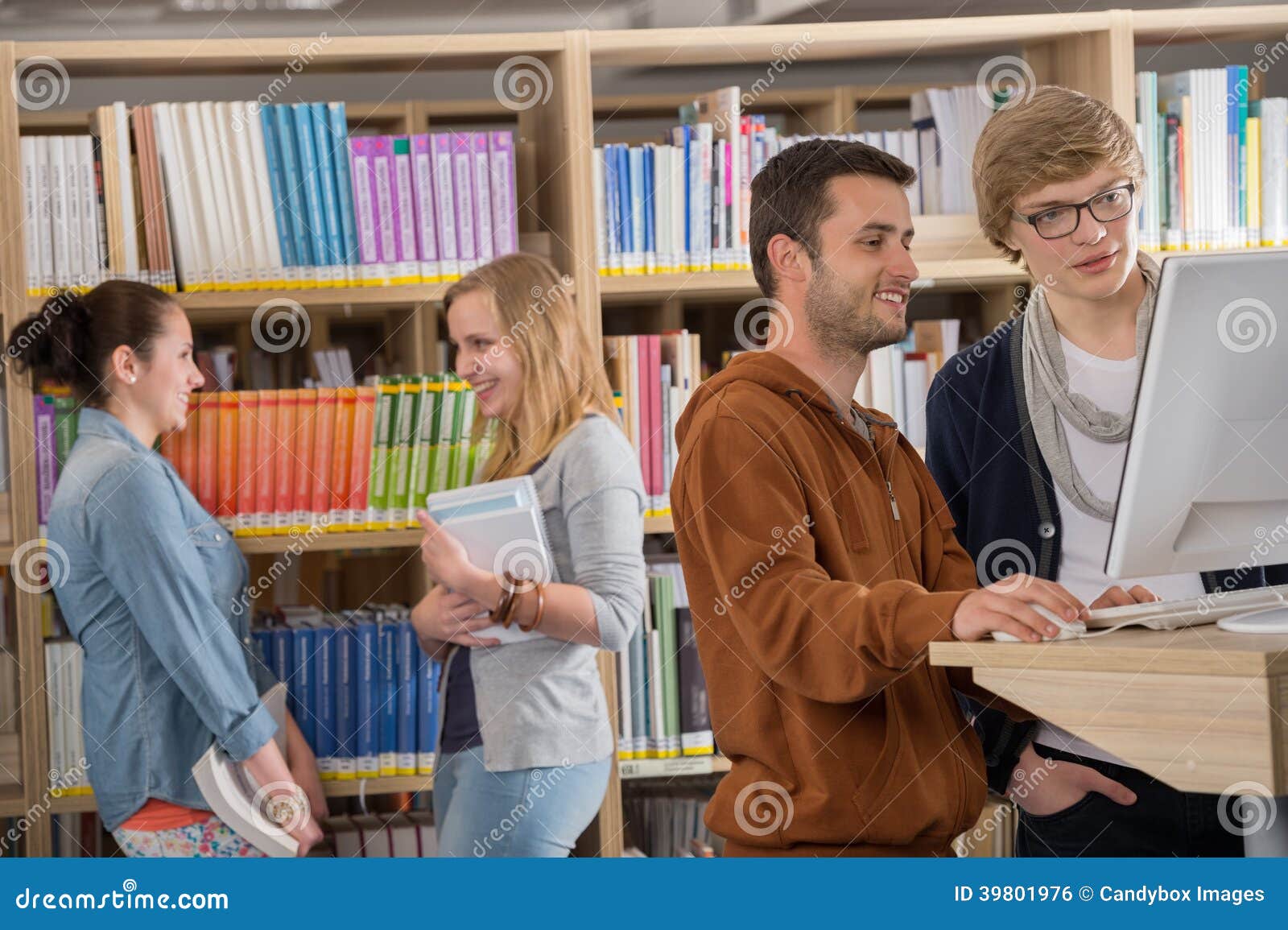 Group of Students Discussing in Library Stock Photo - Image of ...