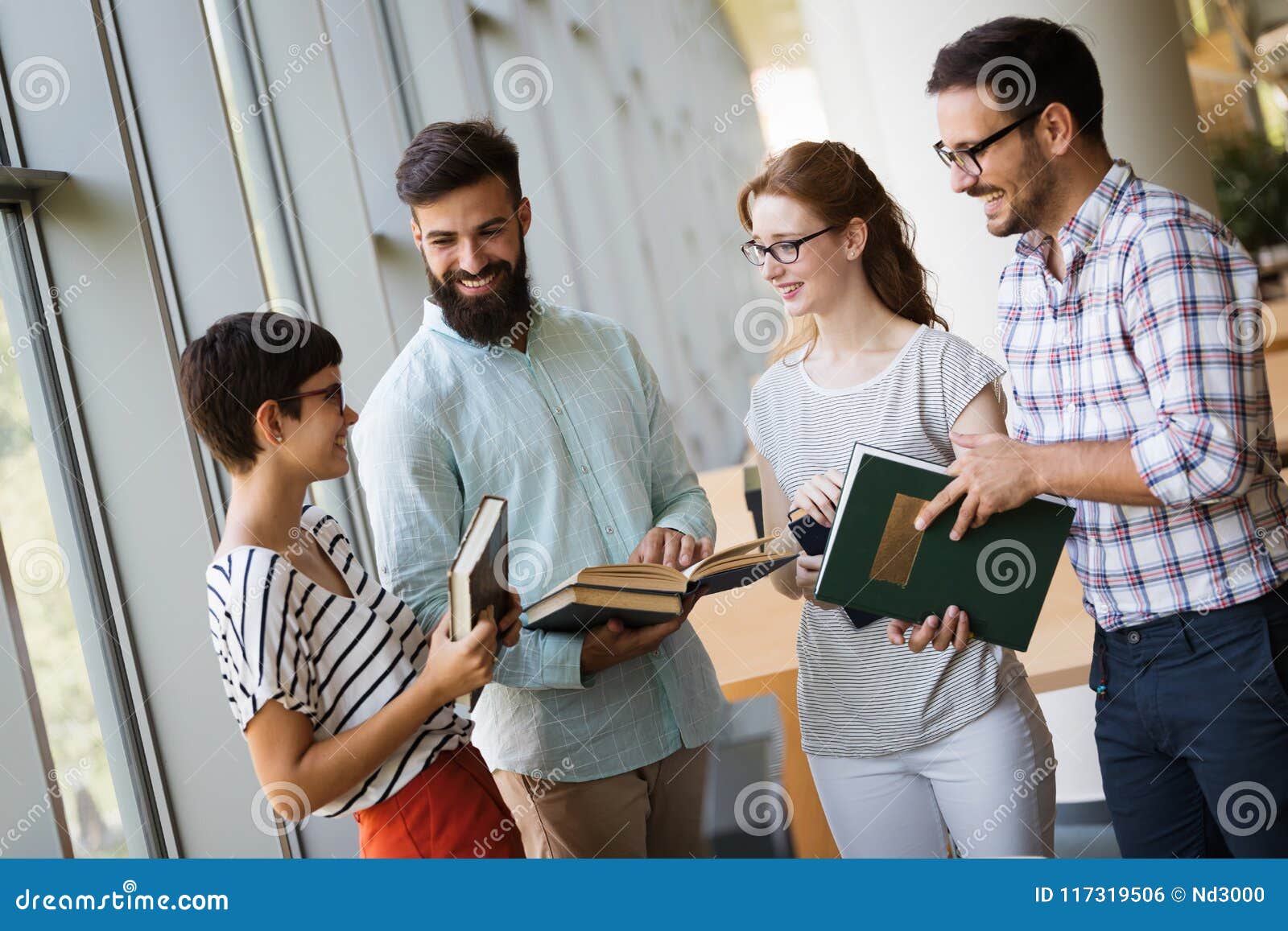 Group of Students Discussing in University Stock Photo - Image of ...