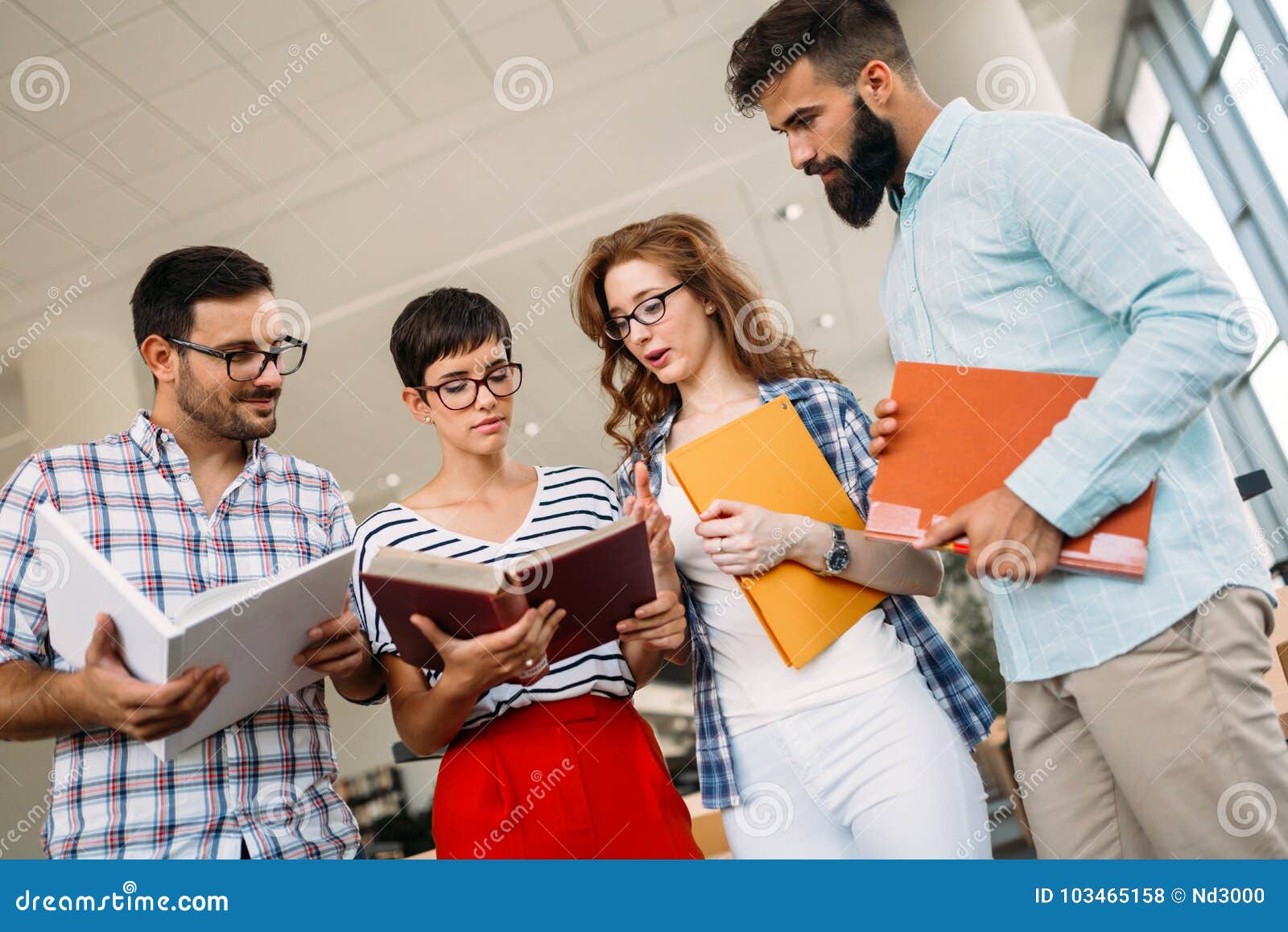 Group of Students Discussing in University Library Stock Photo - Image ...