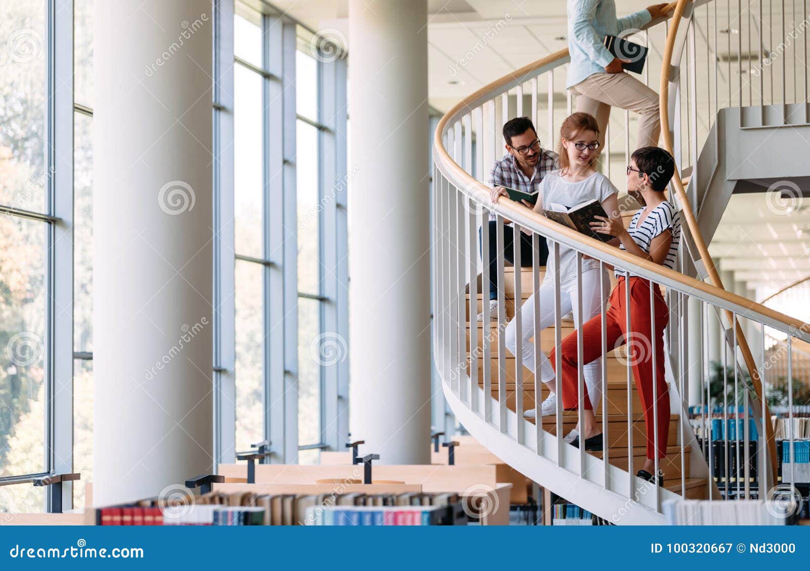 Group of Students Discussing in University Library Stock Image - Image ...