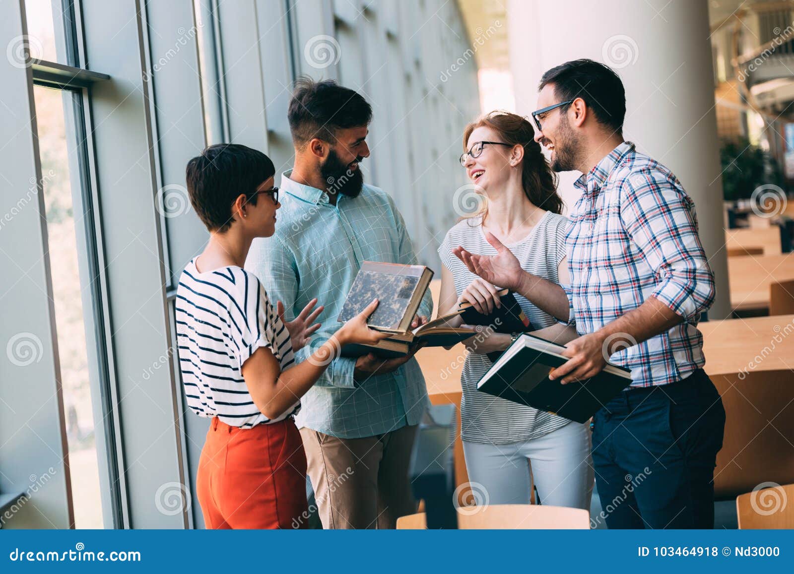 Group of Students Discussing in University Library Stock Photo - Image ...
