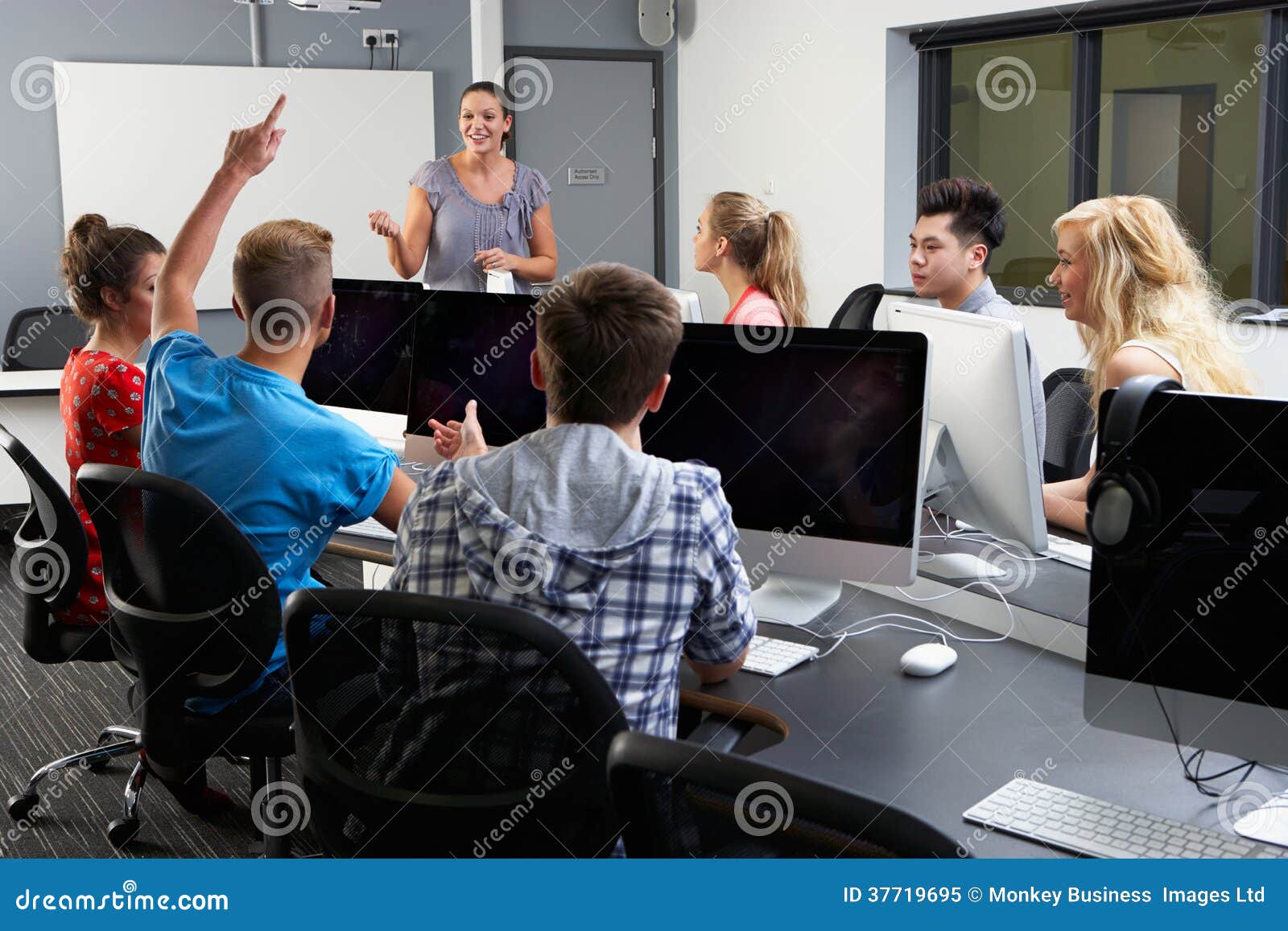 Group of Students with Female Tutor in Computer Class Stock Image ...