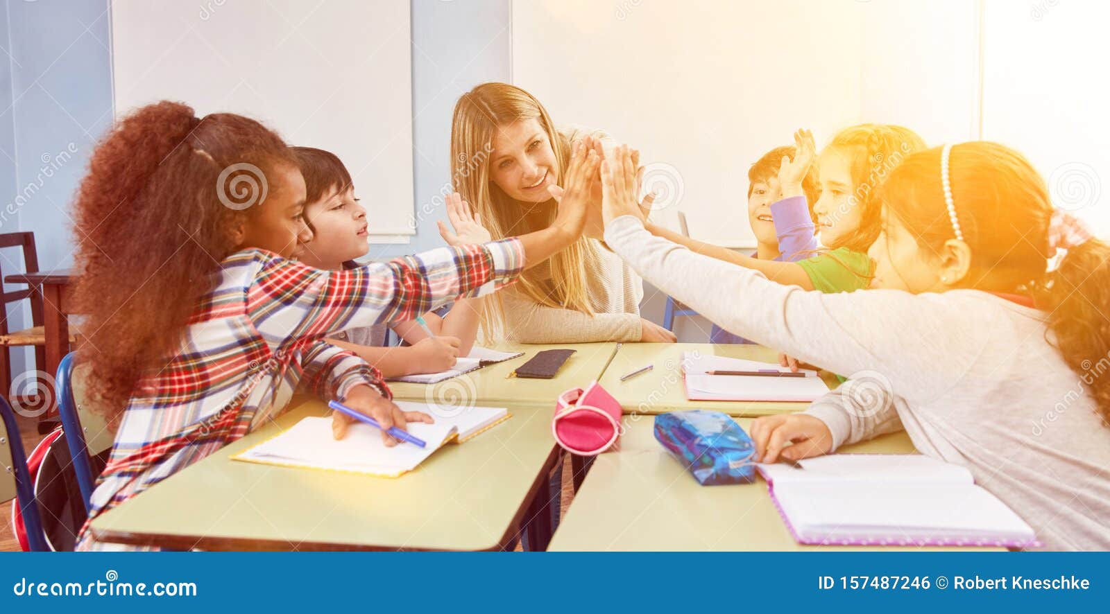 Group of Students Gives High Five in Class Stock Photo - Image of child ...