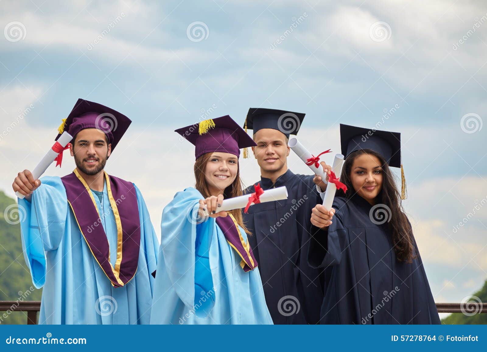 Group of Students in Graduation Gowns and Caps Stock Photo - Image of ...