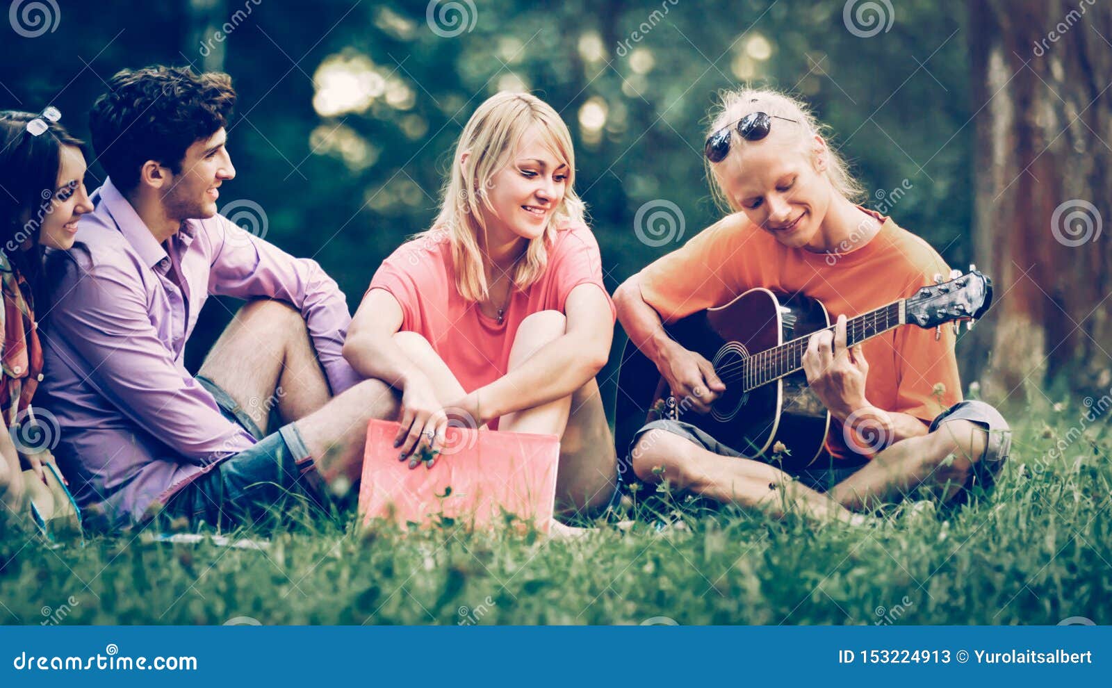 A Group of Students with a Guitar Resting in the Park Stock Image ...