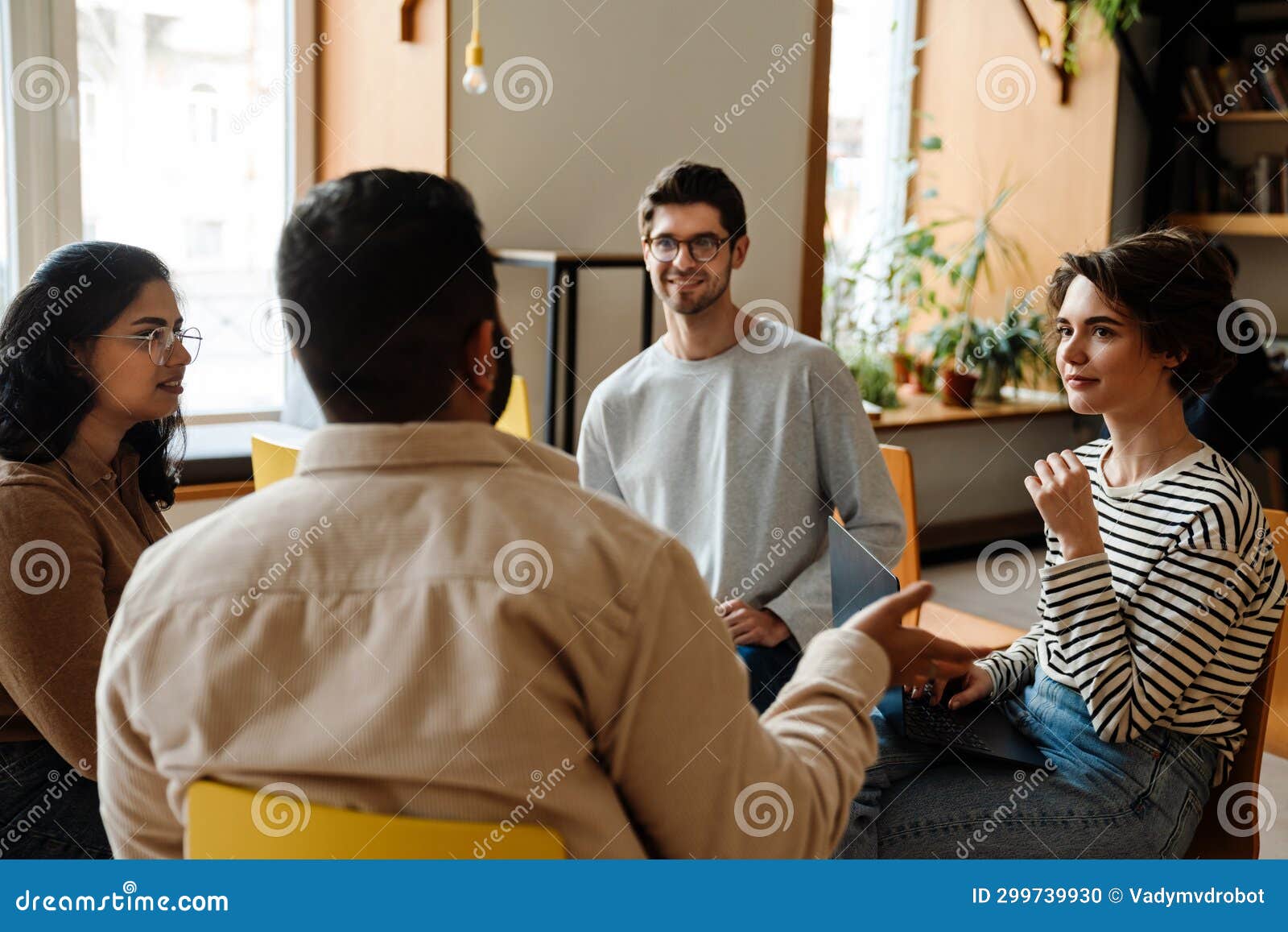 Group of Students Having Discussion while Working on University Project ...
