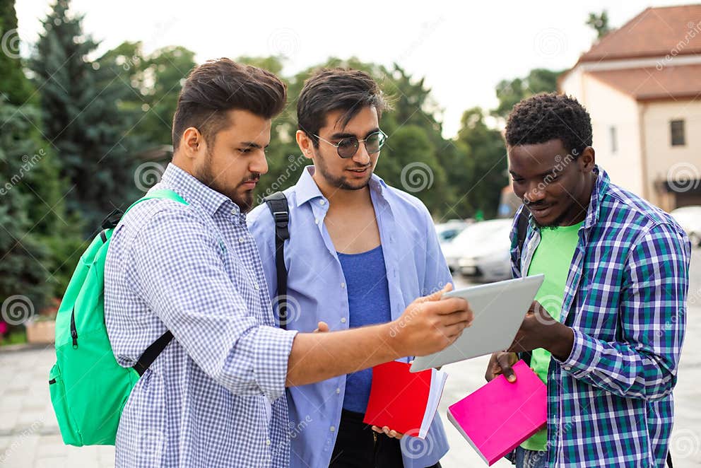 The Group of Students Help Your Classmate with Navigation Stock Image ...