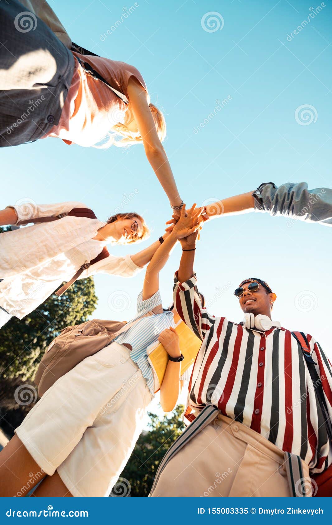 Group of Students Holding Their Hands Together. Stock Image - Image of ...