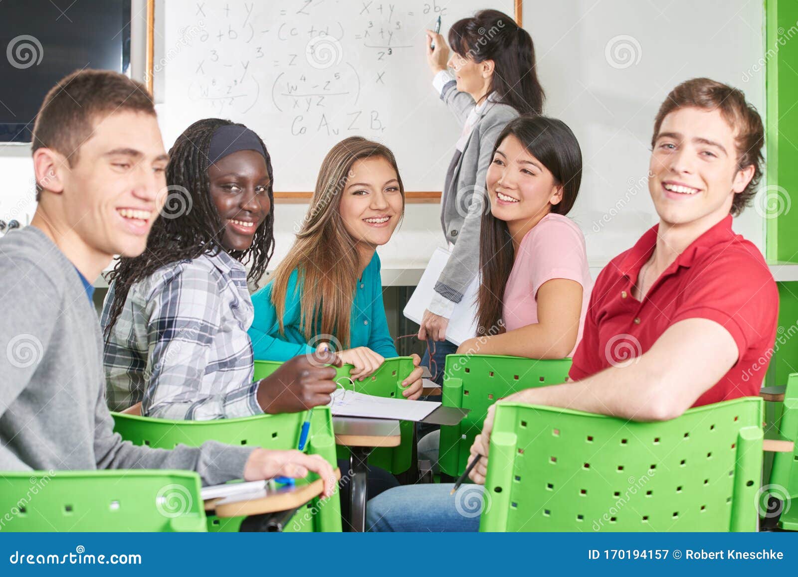 Group of Students Laughs in the Classroom Stock Image - Image of ...