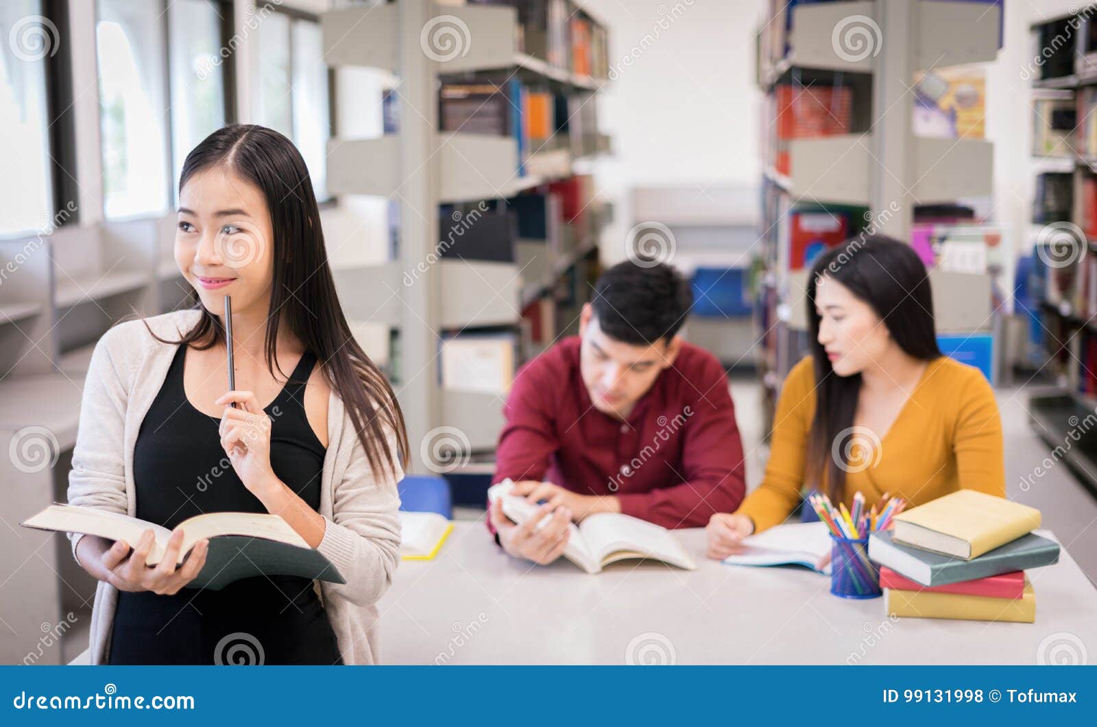 Students leading book stock photo. Image of cheerful - 99131998