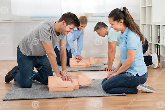 Group of Students Learning Cpr Stock Image - Image of instructor ...