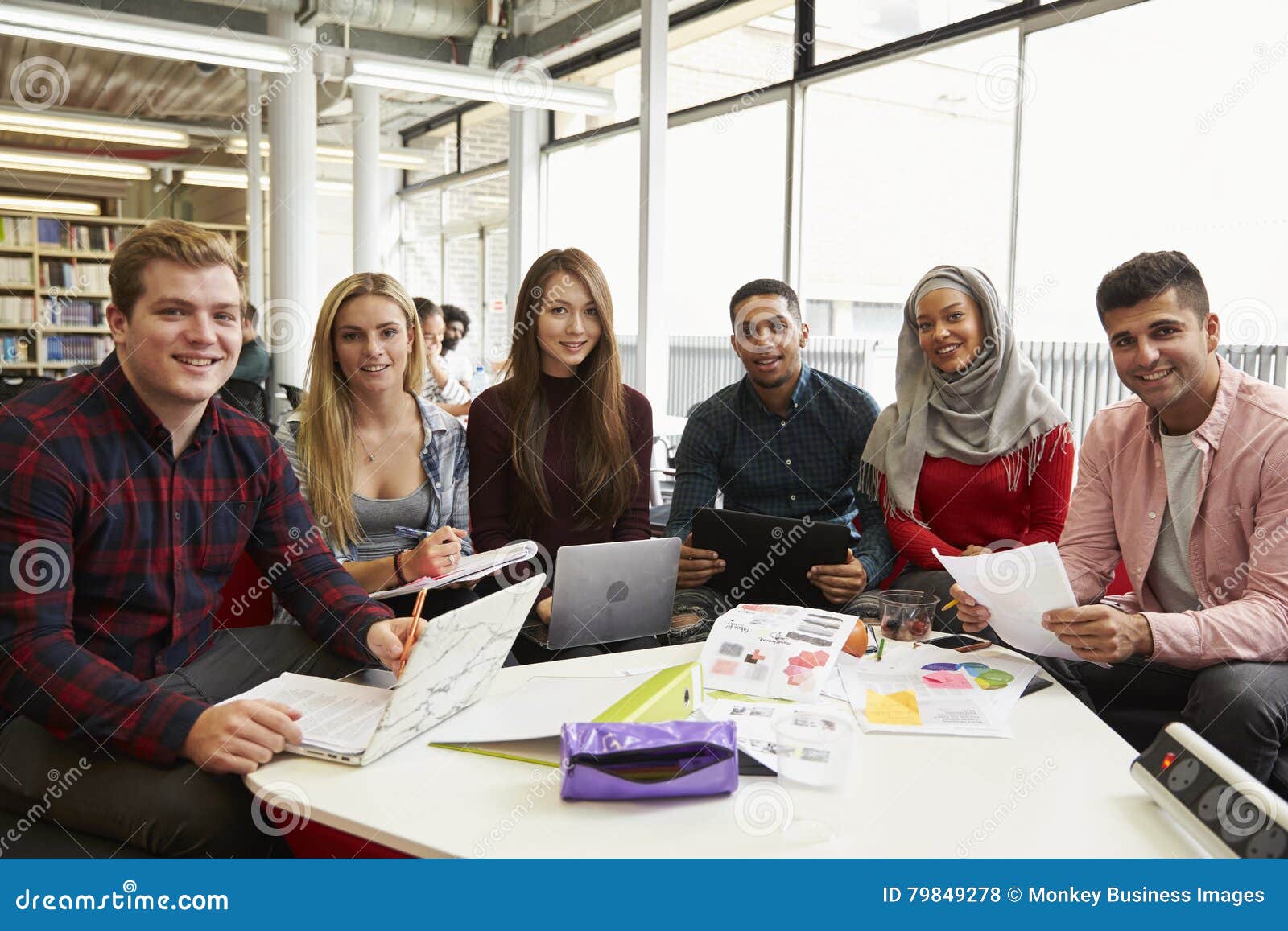 Group of Students in Library Collaborating on Project Stock Photo ...