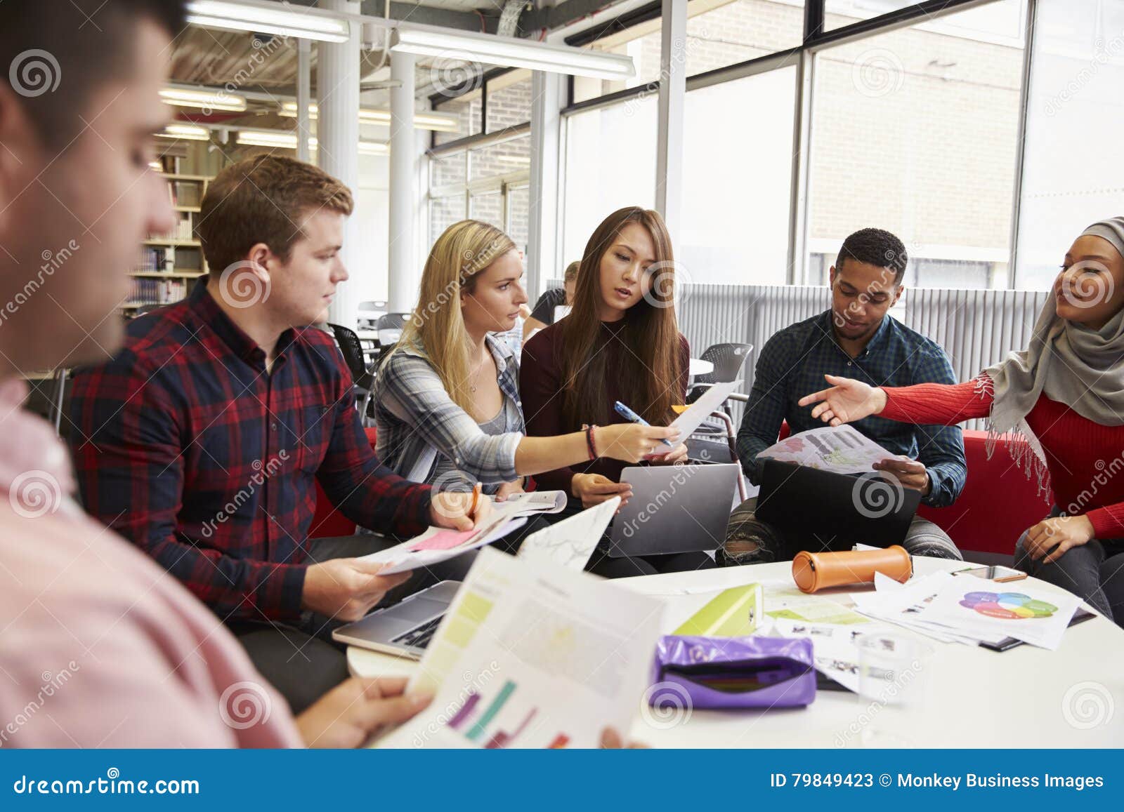 Group of Students in Library Collaborating on Project Stock Image ...